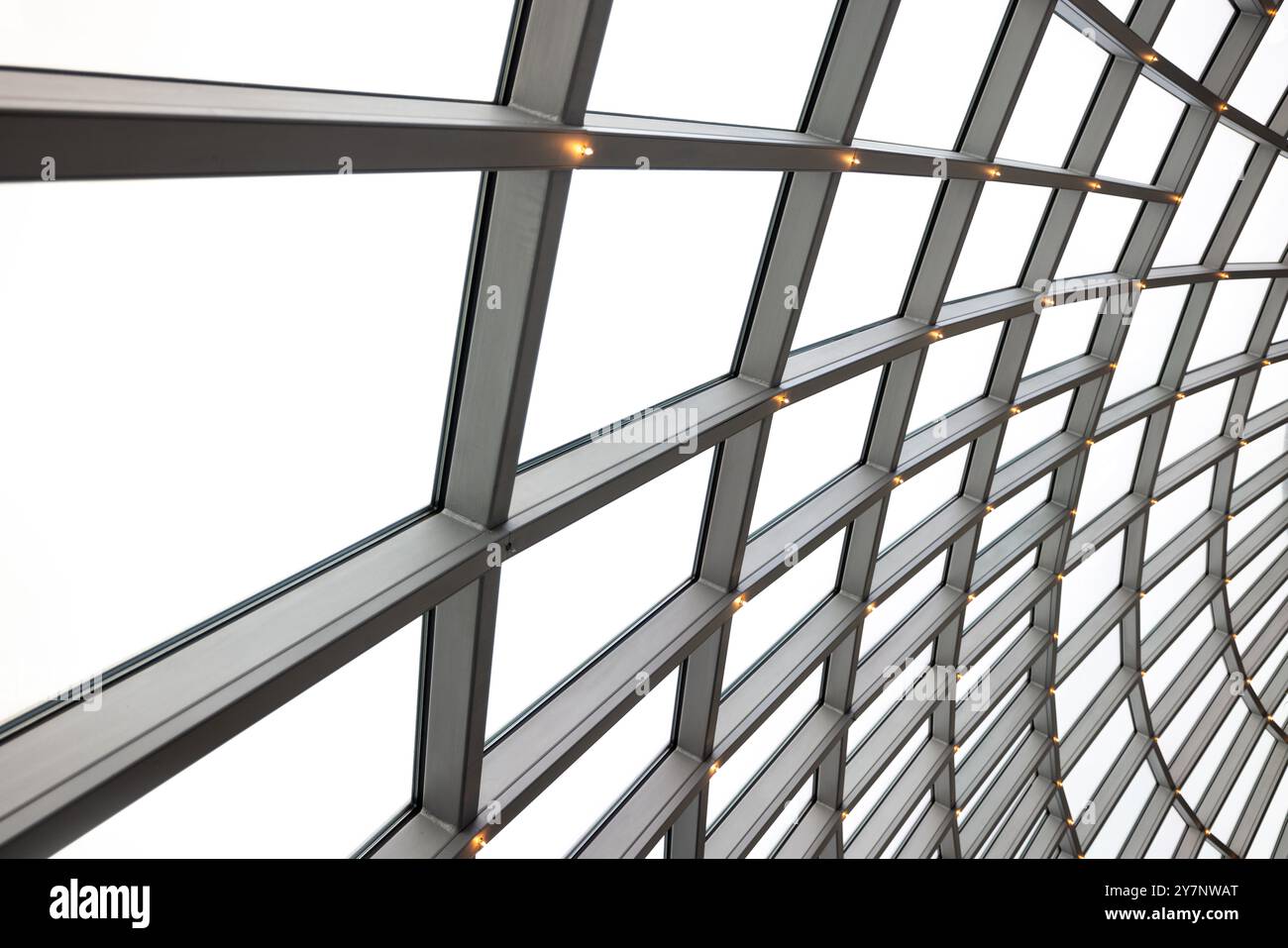 A modern architectural ceiling with geometric grid pattern and small ...