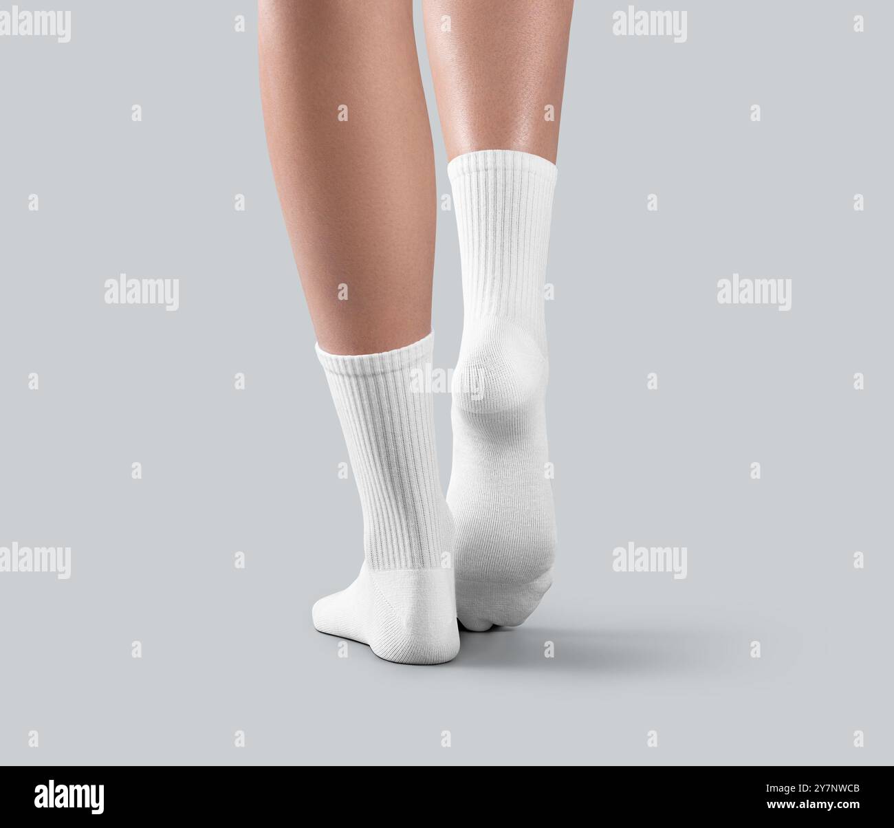 Mockup of white high socks on women's legs, one foot with stretched ...