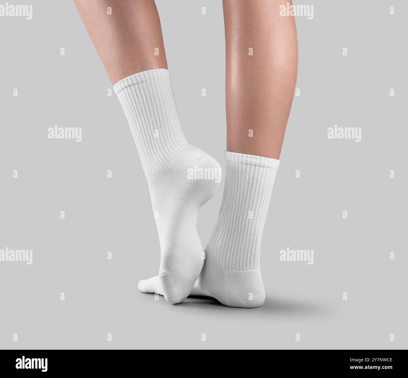 Template of white high gaiters on women's legs, one foot with stretched ...