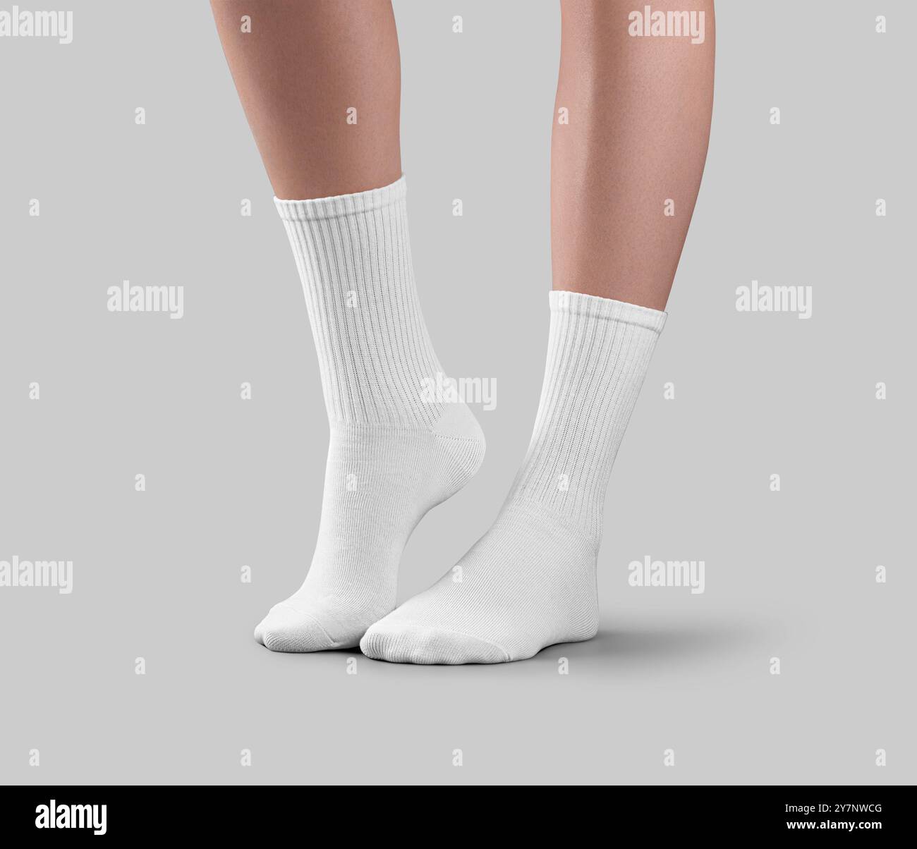 Template of white long socks on women's legs, one foot with stretched ...