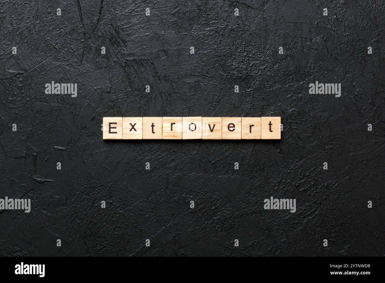 extrovert word written on wood block. extrovert text on table, concept ...