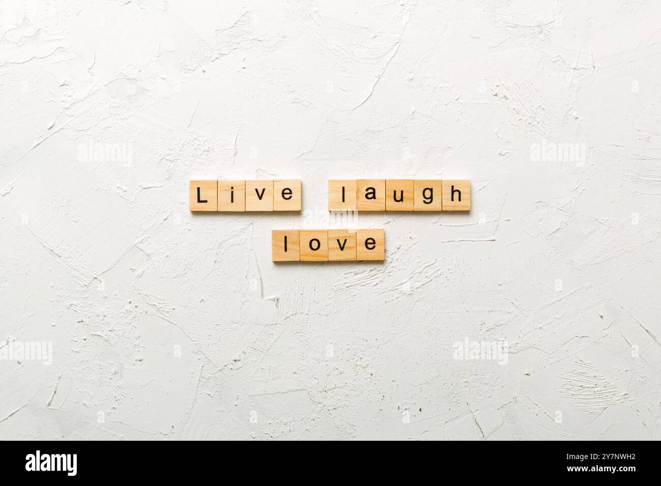 Live laugh love word written on wood block. Live laugh love text on ...