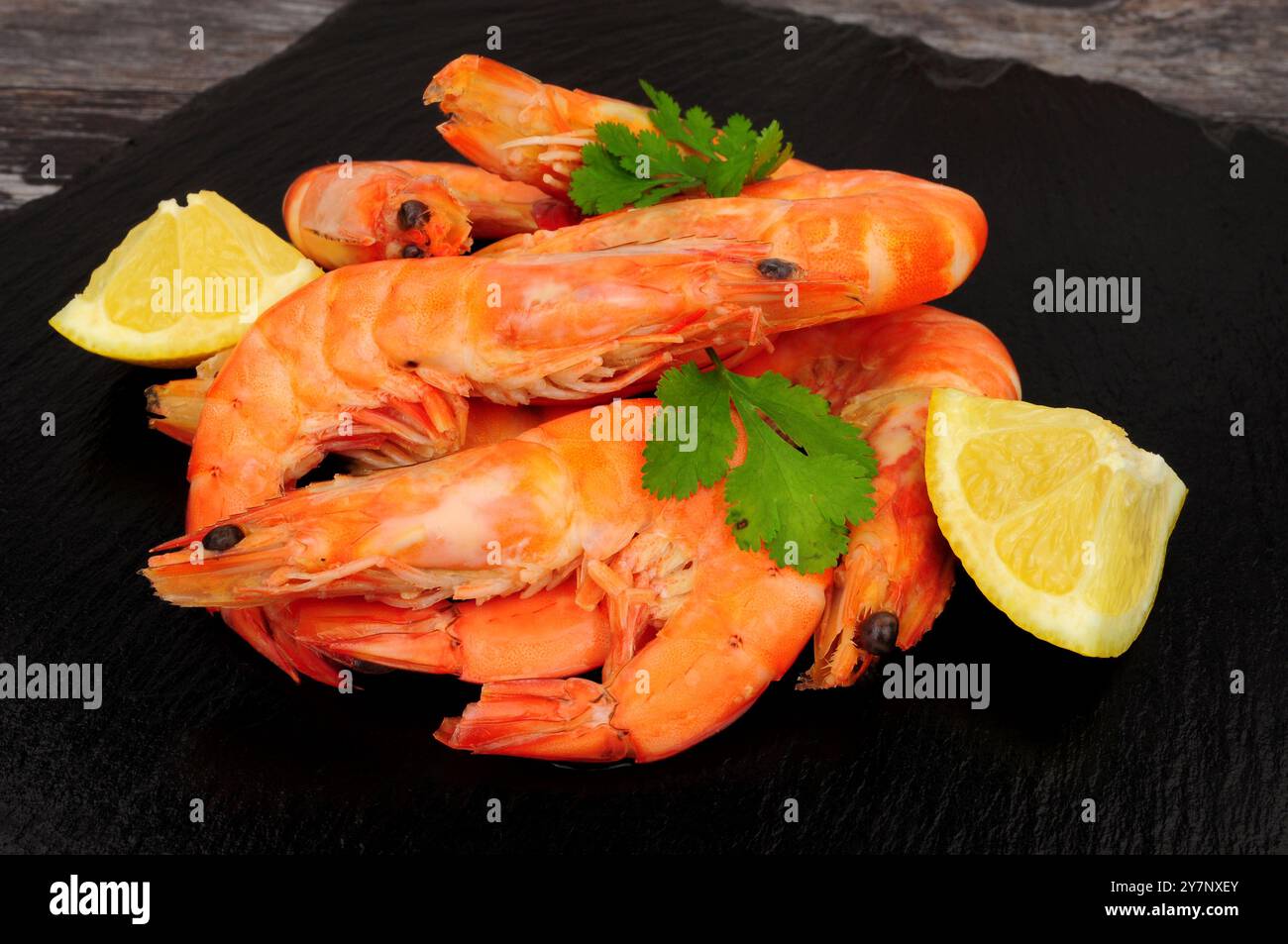 Group of freshly cooked shell on crevettes with lemon and parsley herb ...