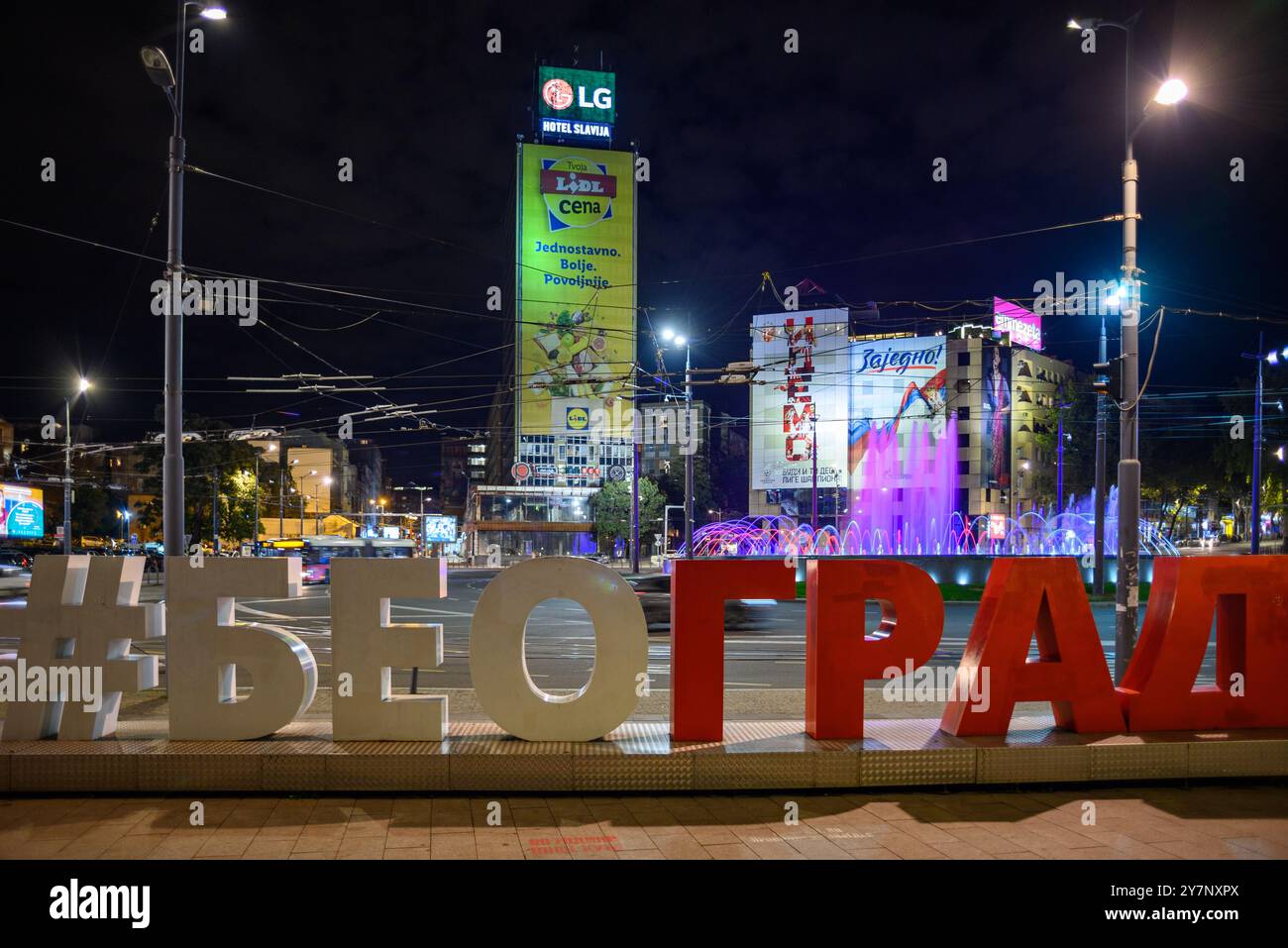Night view of illuminated fountain at Slavija square roundabout and ...