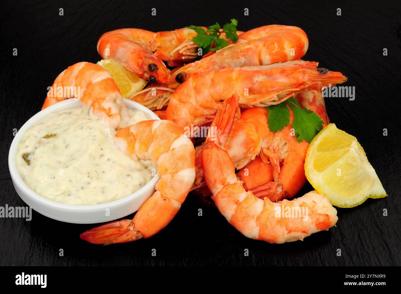 Group of freshly cooked shell on crevettes with lemon and parsley herb ...