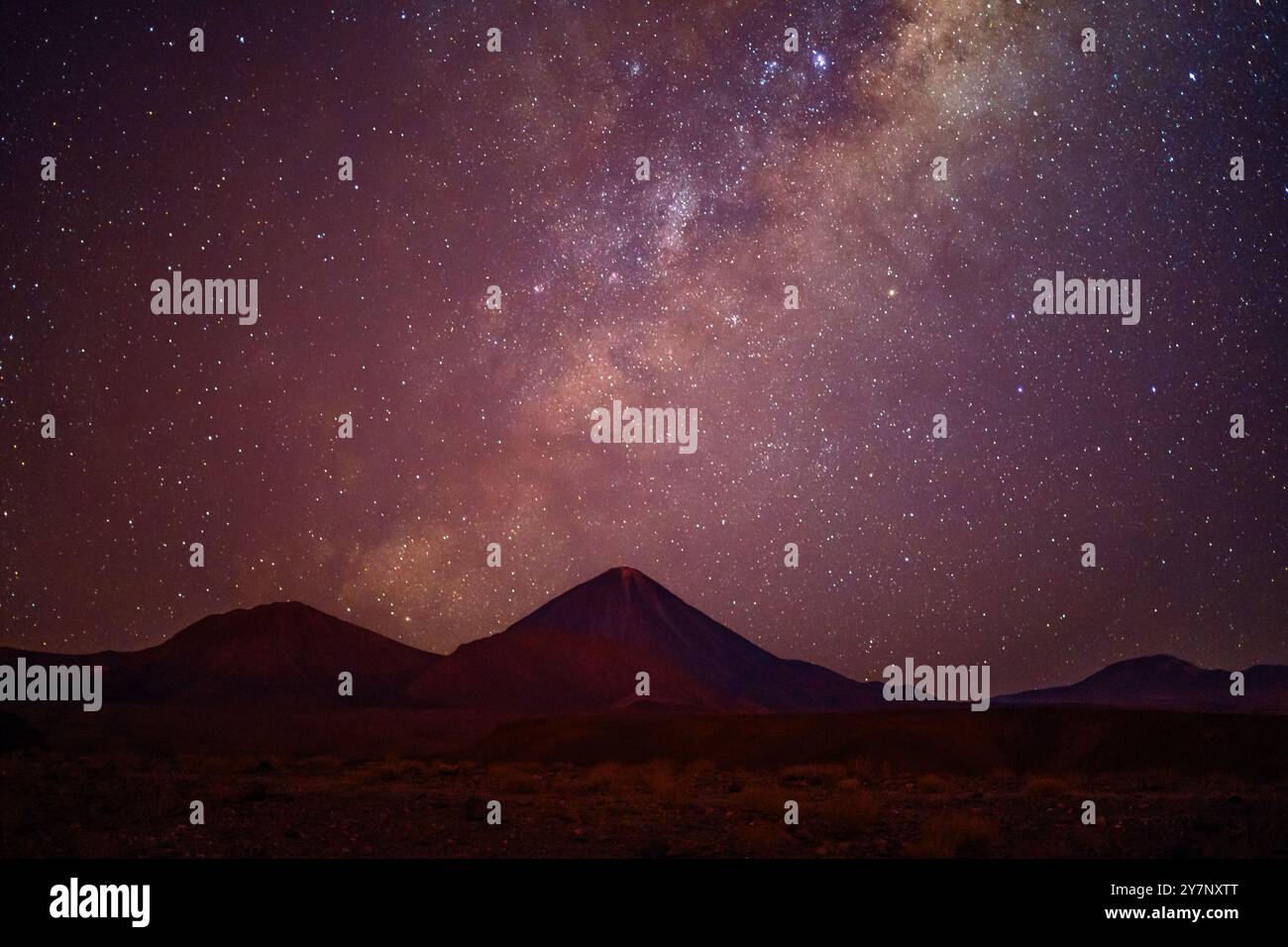 A stunning night sky over Likanabur Volcano with the Milky Way galaxy ...