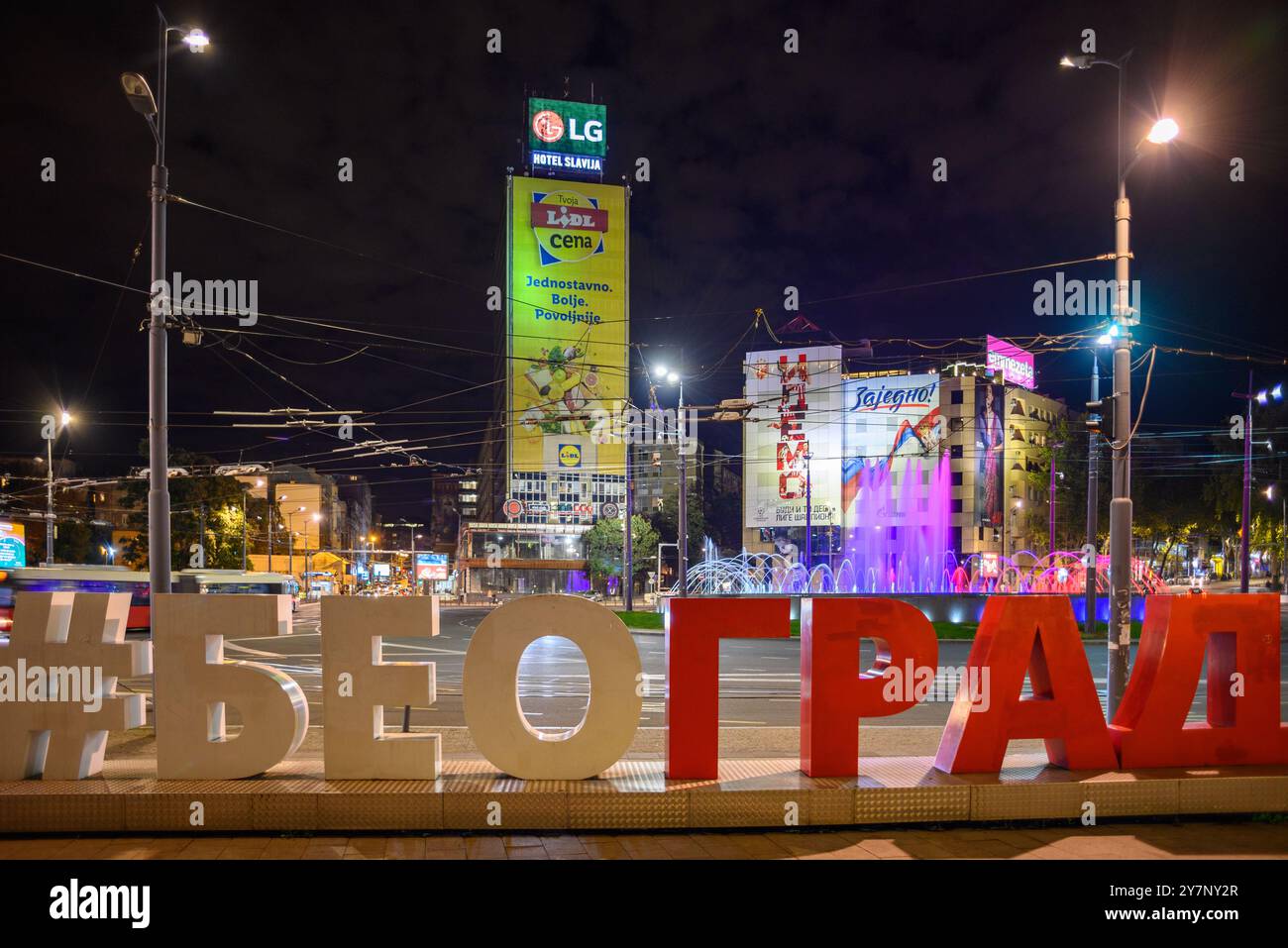 Night view of illuminated fountain at Slavija square roundabout and ...
