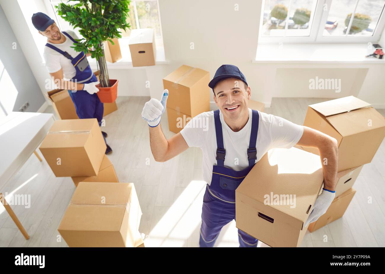 Smiling Mover Portrait with Thumbs Up during Office or Home Relocation ...