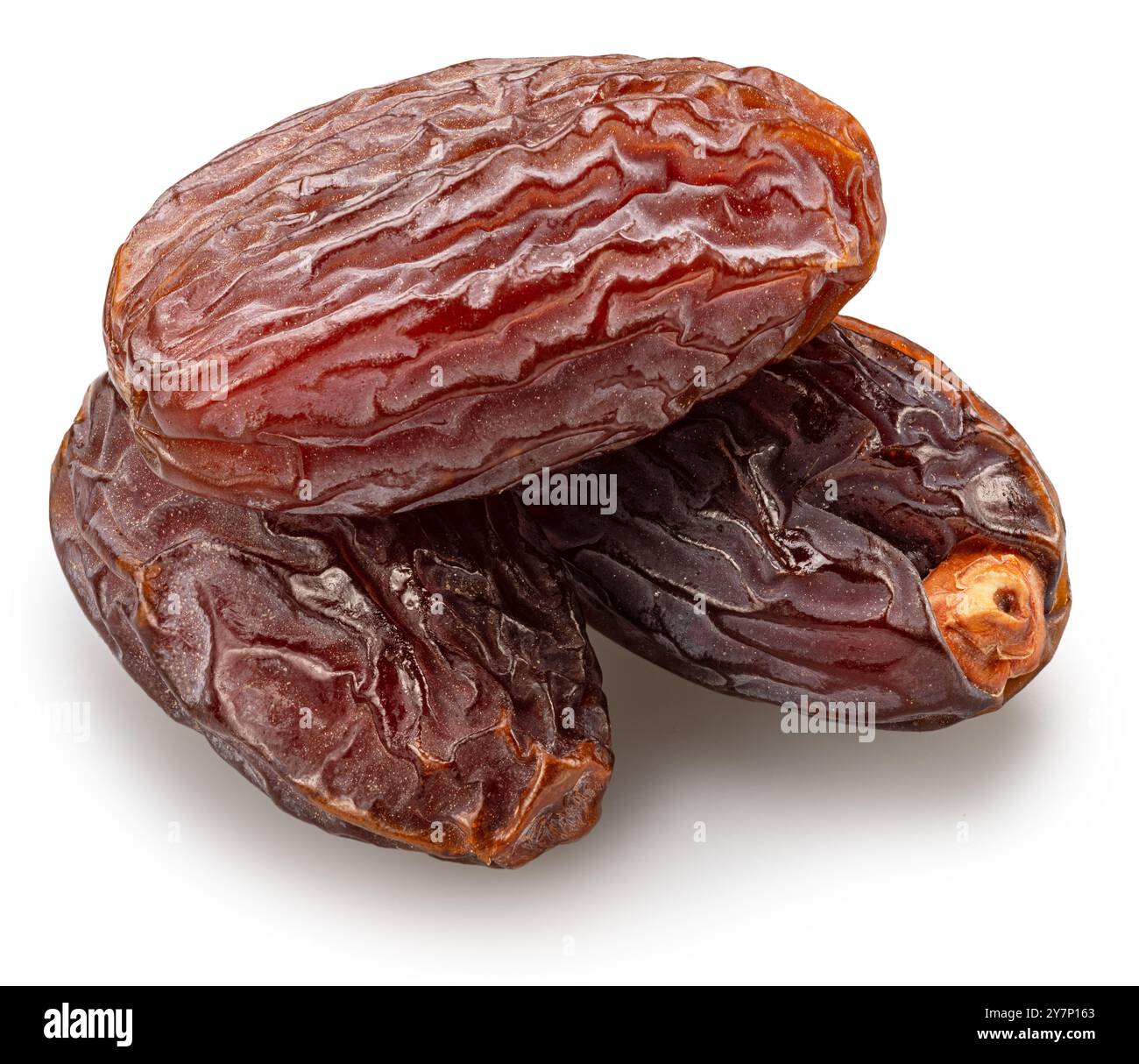 Three semi-dry dates, or date palm fruits isolated on white background ...