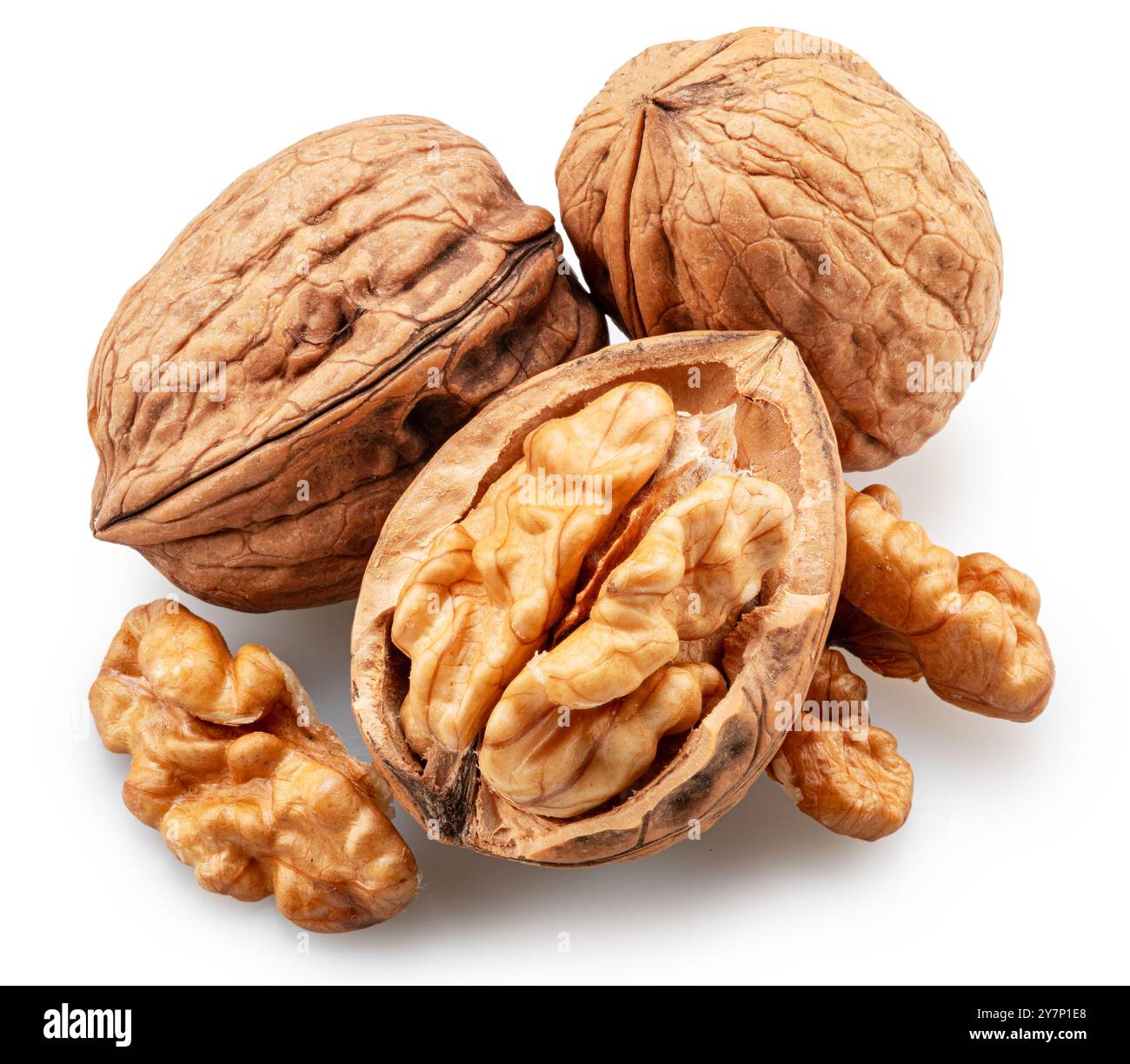 Whole walnuts, broken walnut with kernel and green leaves isolated on ...