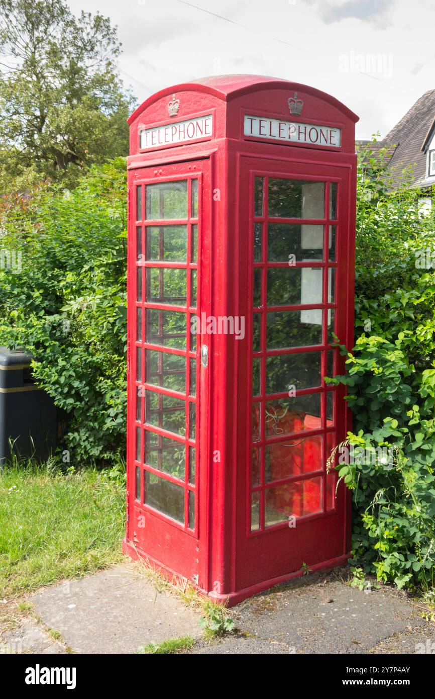 A redundant red British telephone box, in the K6 pattern designed by Giles Gilbert Scott, the ...