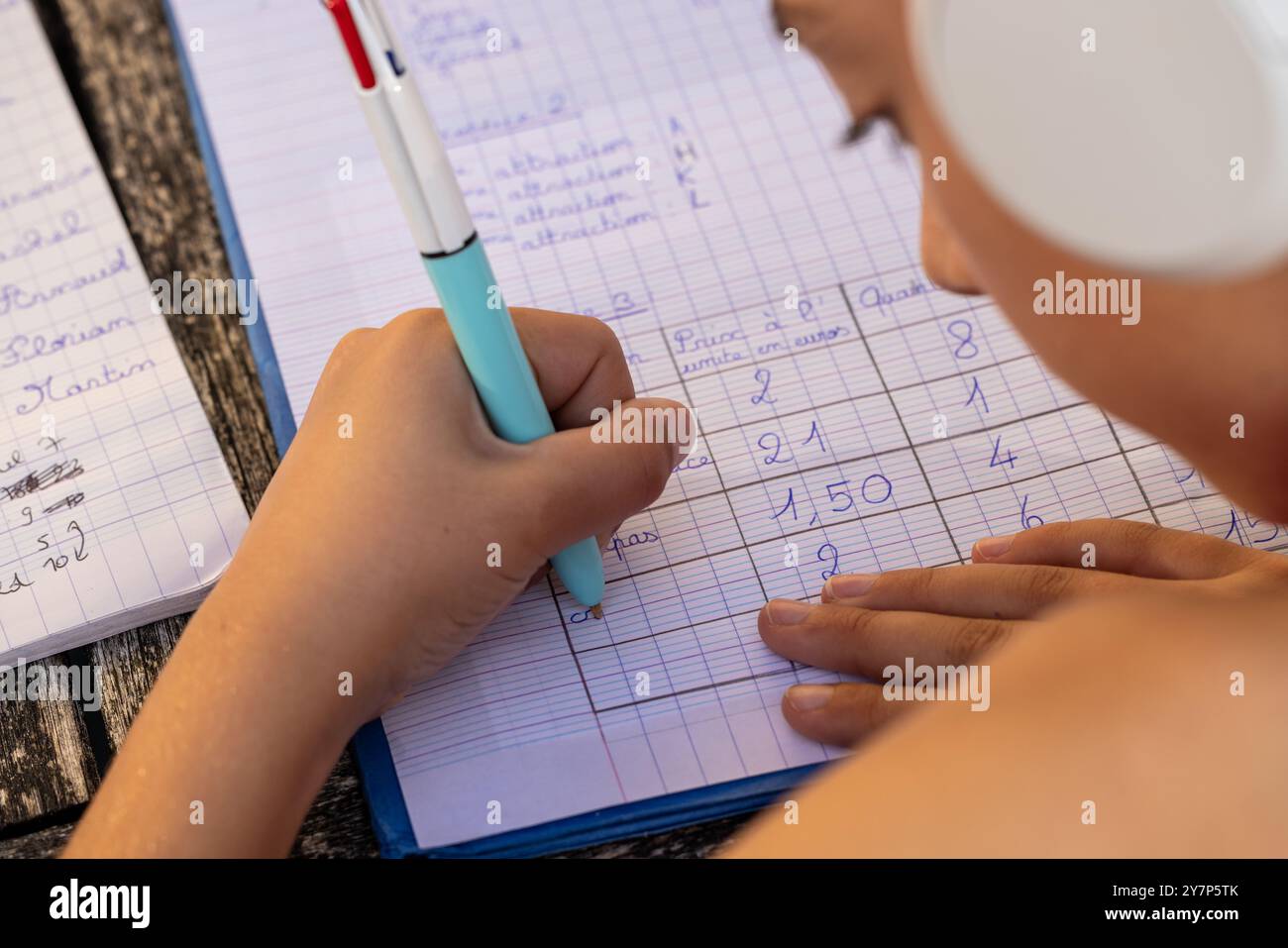 French schoolgirl doing her math homework Stock Photo - Alamy