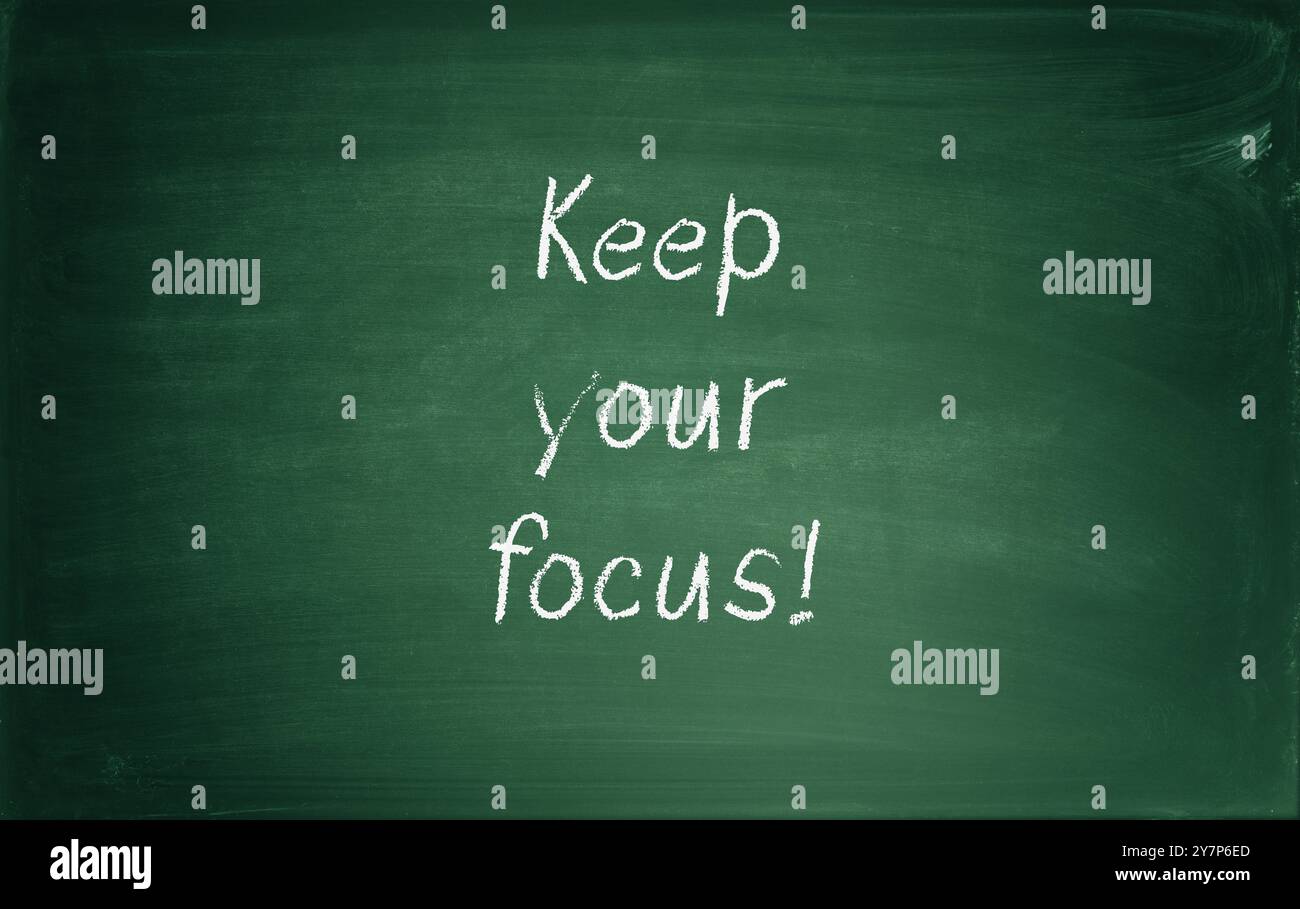 Green chalkboard with the text Keep your focus , vintage color toned ...