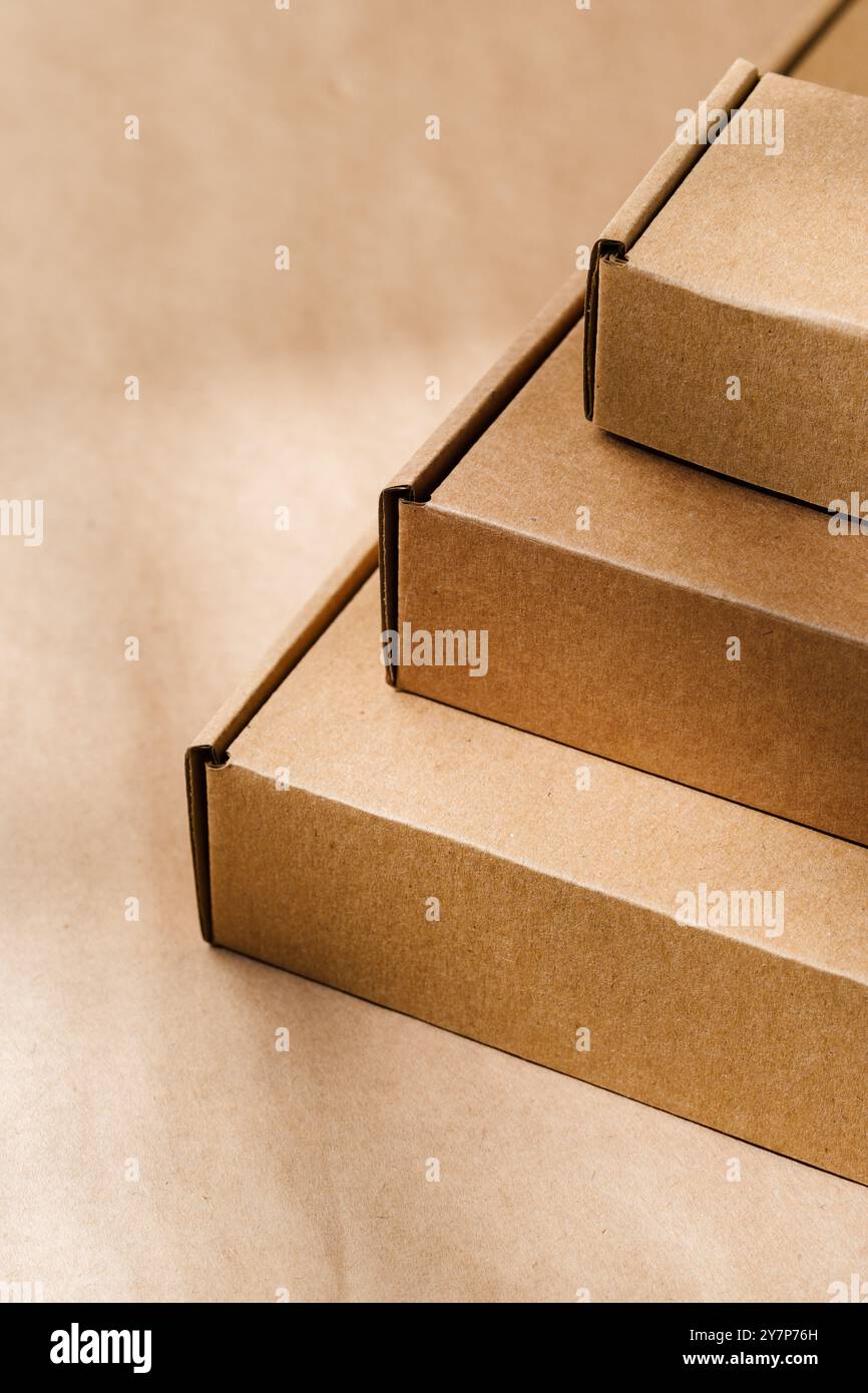 Stacked cardboard boxes on a neutral background in a shipping or ...