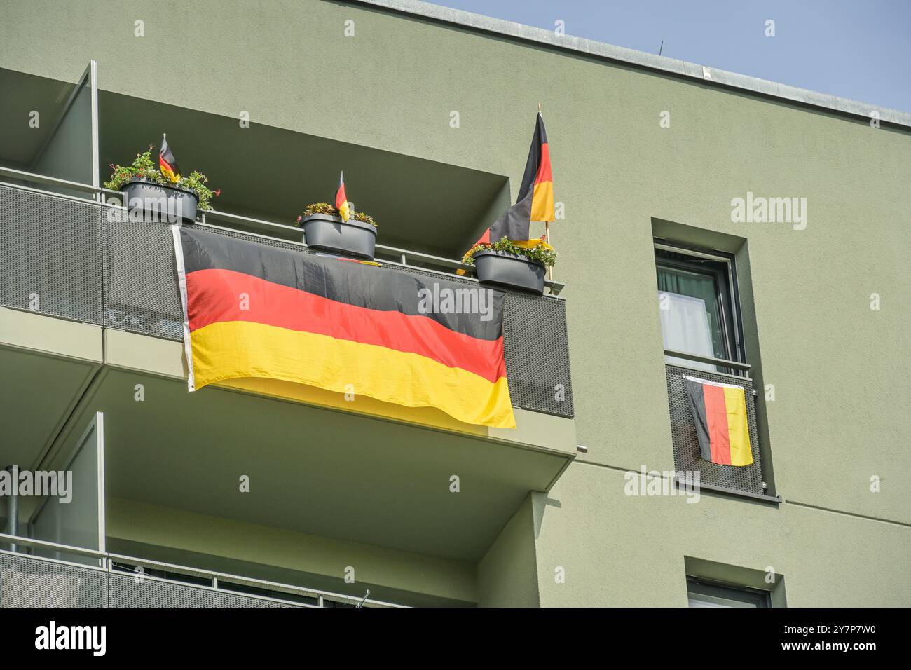 German flag, balcony, residential building, Senftenberger Ring ...