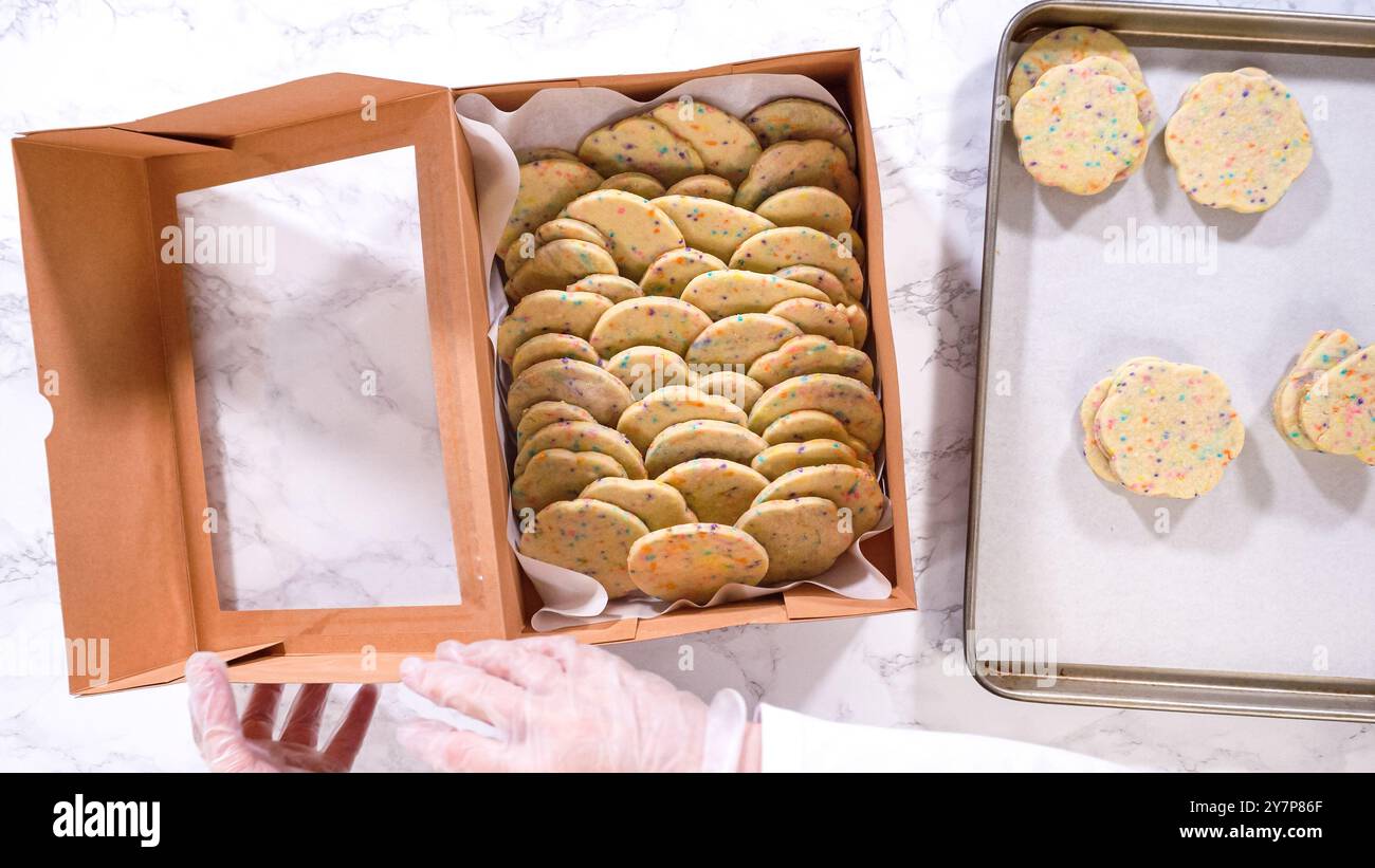 Packing Sprinkle-Adorned Sugar Cookies into Boxes Stock Photo - Alamy