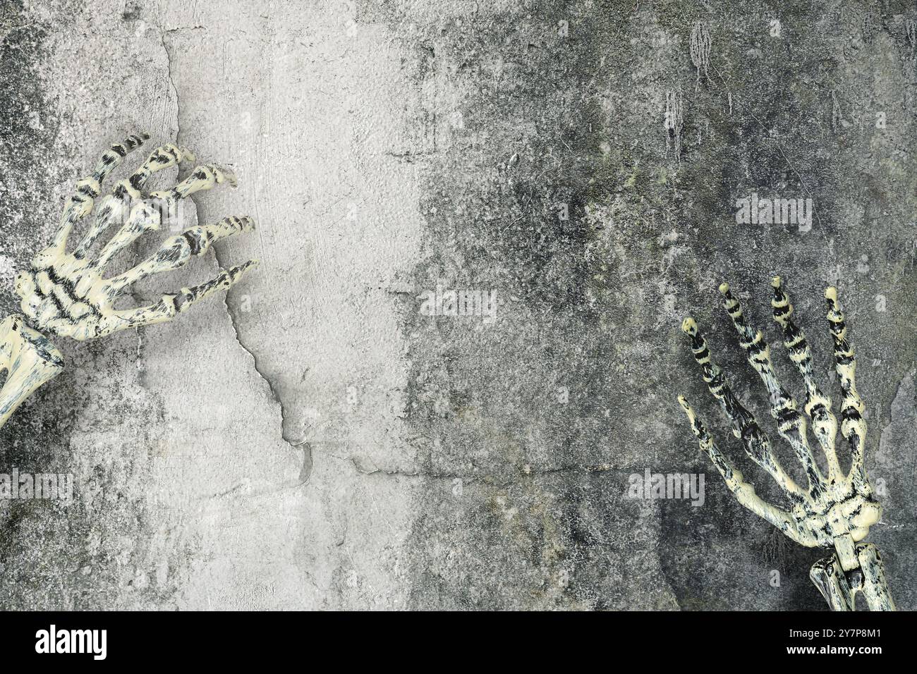 Human skeleton hand reaching out in wall, with a creepy, dark and scary ...