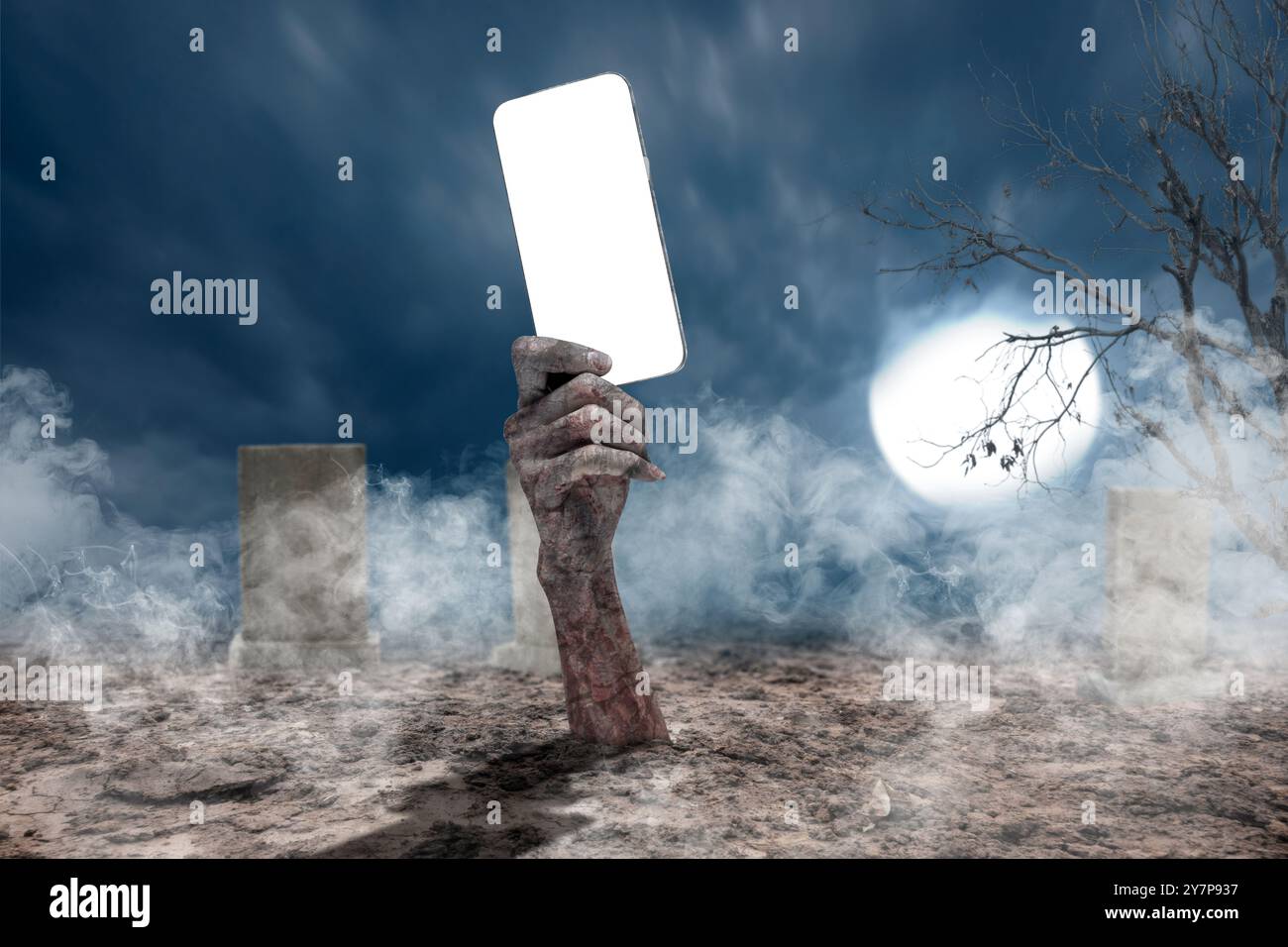 Zombie hand with bloody wound rising out of ground holding mobile phone ...