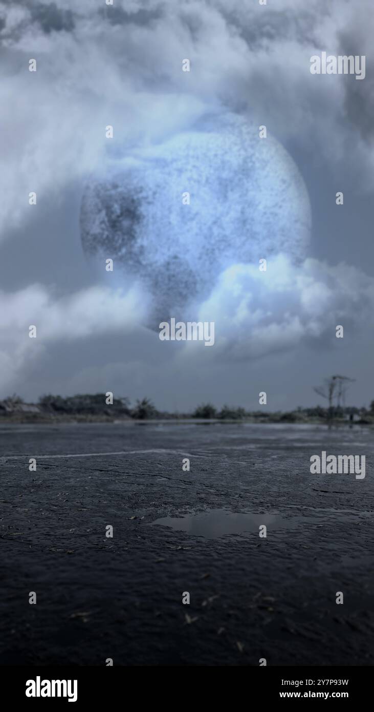 Large full moon in the sky above wet, muddy field. Scene is dark and ...