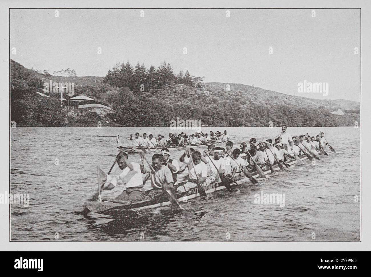 Men reaching the finish line in a War-Canoe Race , Sports event at ...