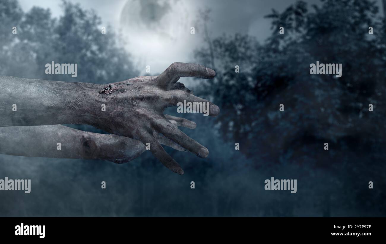 Zombie hands with bloody wound shown in a dark forest with a moon in ...