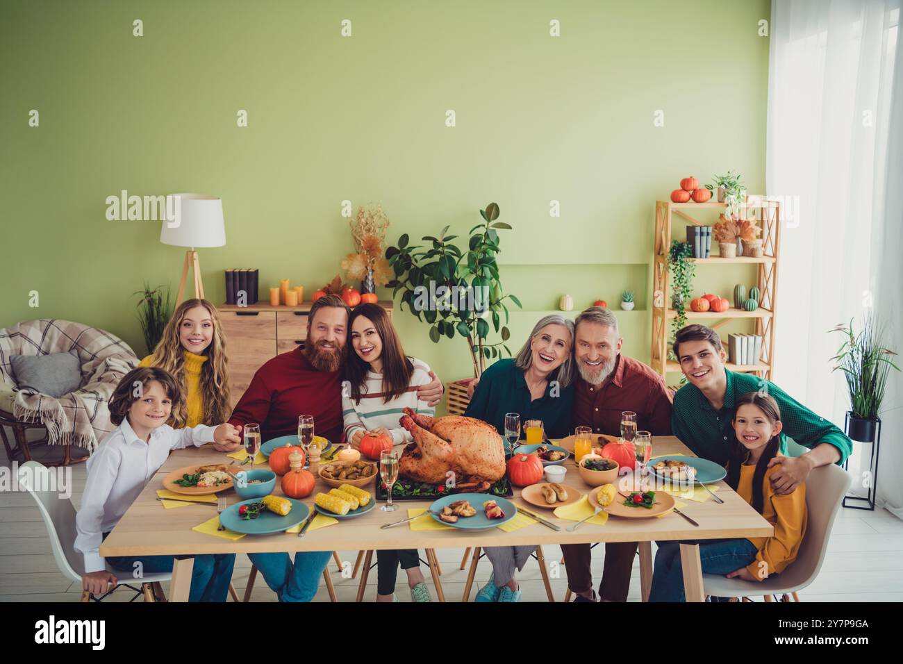 Portrait of cheerful people celebrating thanksgiving day traditional ...