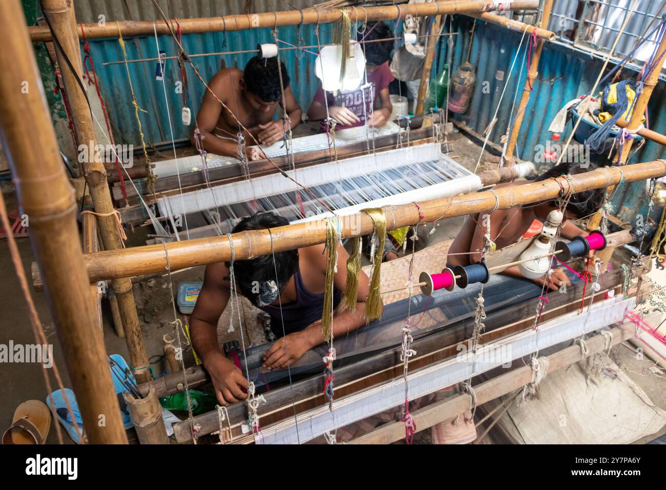 October 1, 2024, Narayanganj, Dhaka, Bangladesh: Weavers make the Jamdani saree on a loom in ...