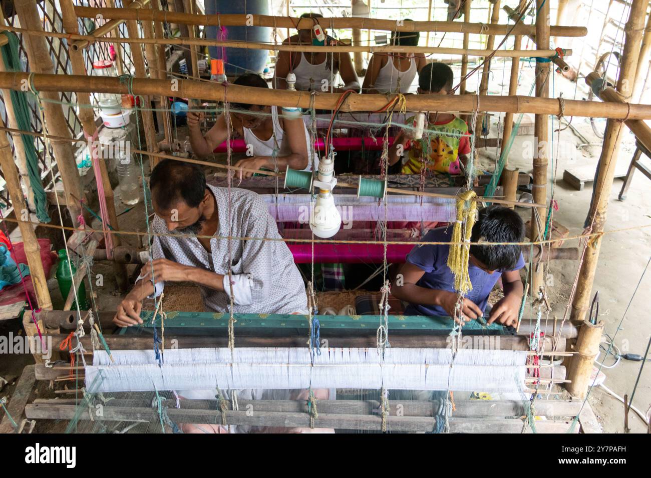 October 1, 2024, Narayanganj, Dhaka, Bangladesh: Weavers make the Jamdani saree on a loom in ...