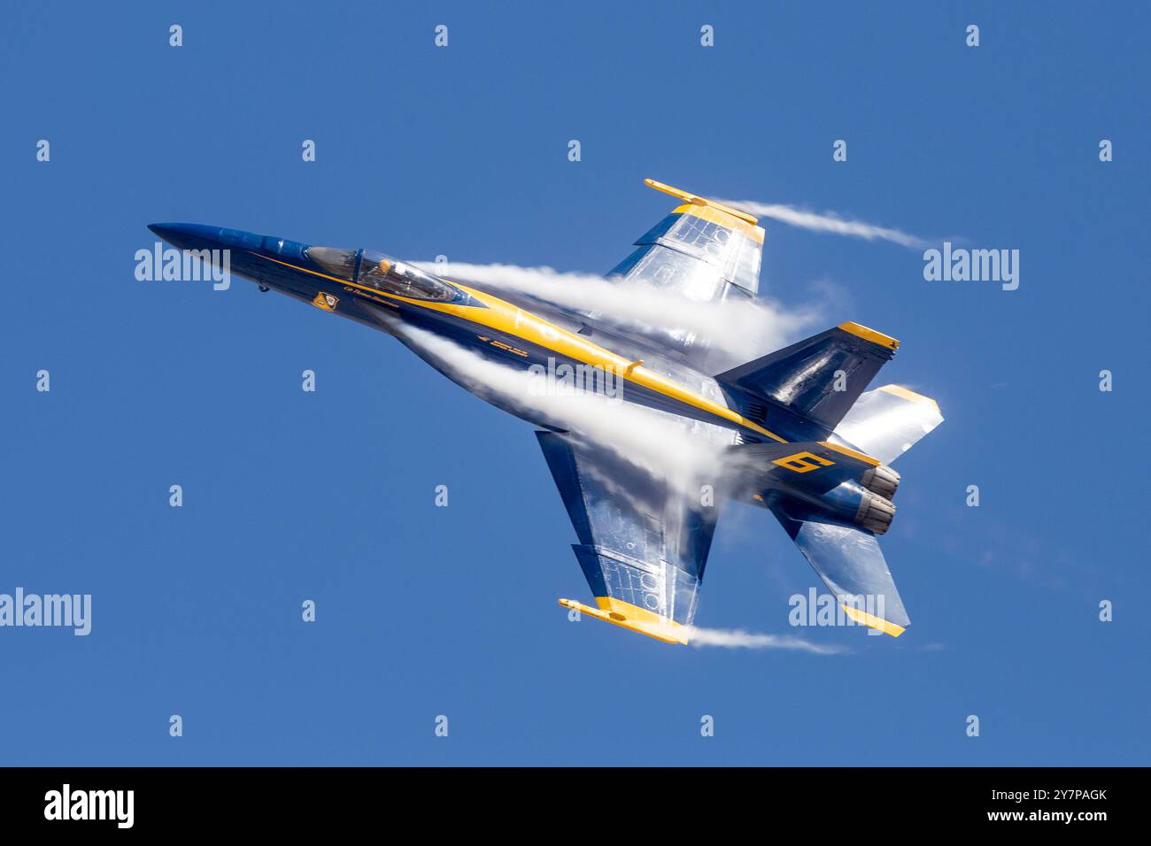 A U.S. Navy Blue Angel performs aerobatic formation maneuvers during ...
