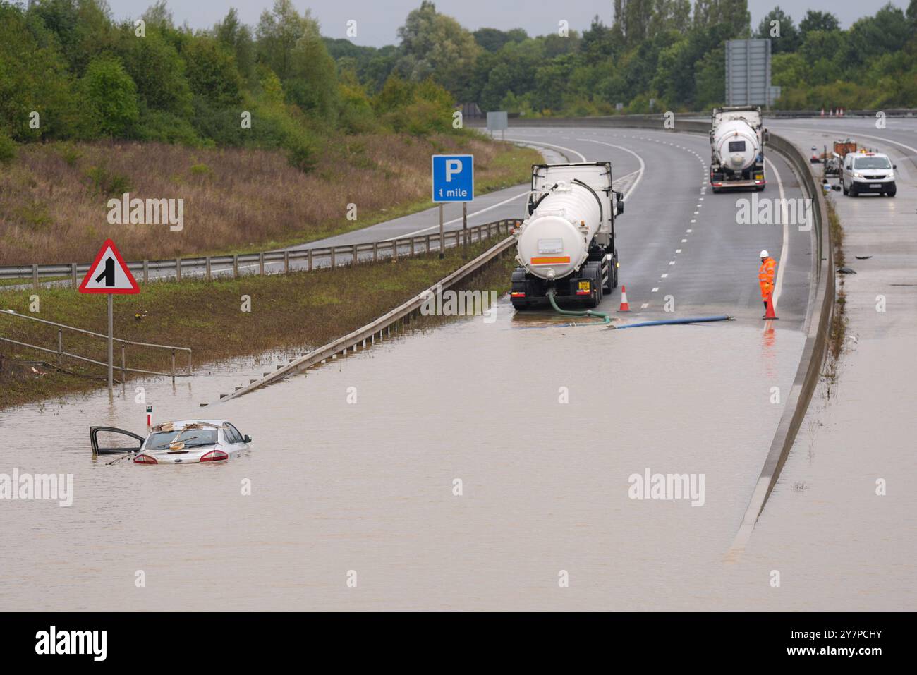 A car remains submerged in flood water on the A421 in Marston Moretaine ...