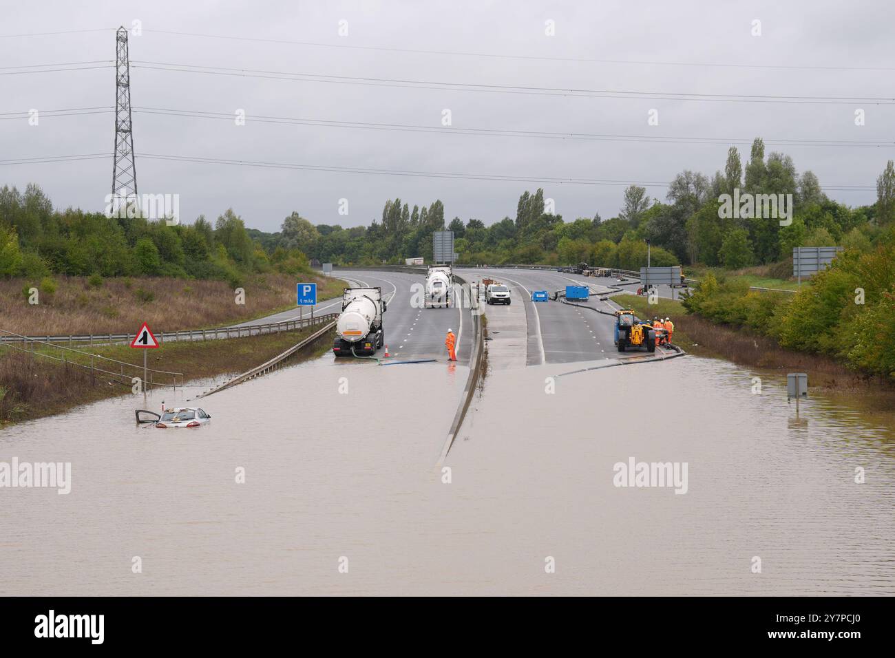 A car remains submerged in flood water on the A421 in Marston Moretaine ...