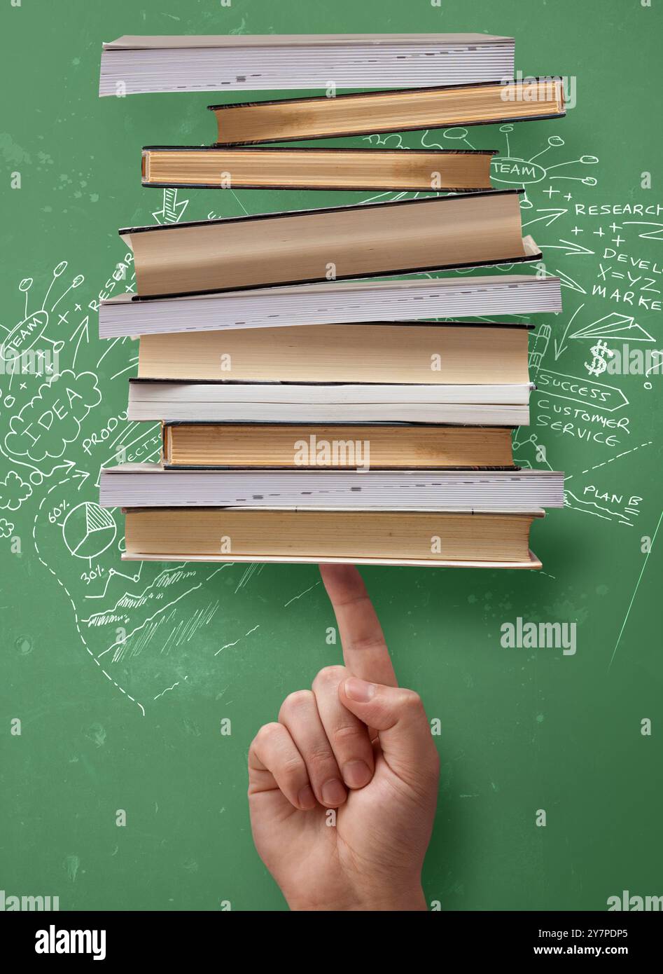 Holding A stack Of Books Learning And Education concept Stock Photo - Alamy