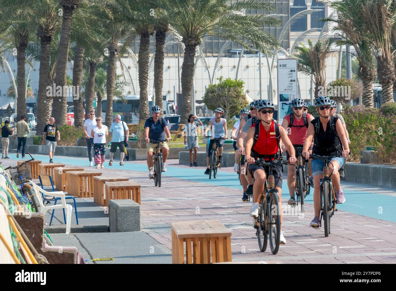 People Cycling early morning workout at corniche on Qatar Notional ...