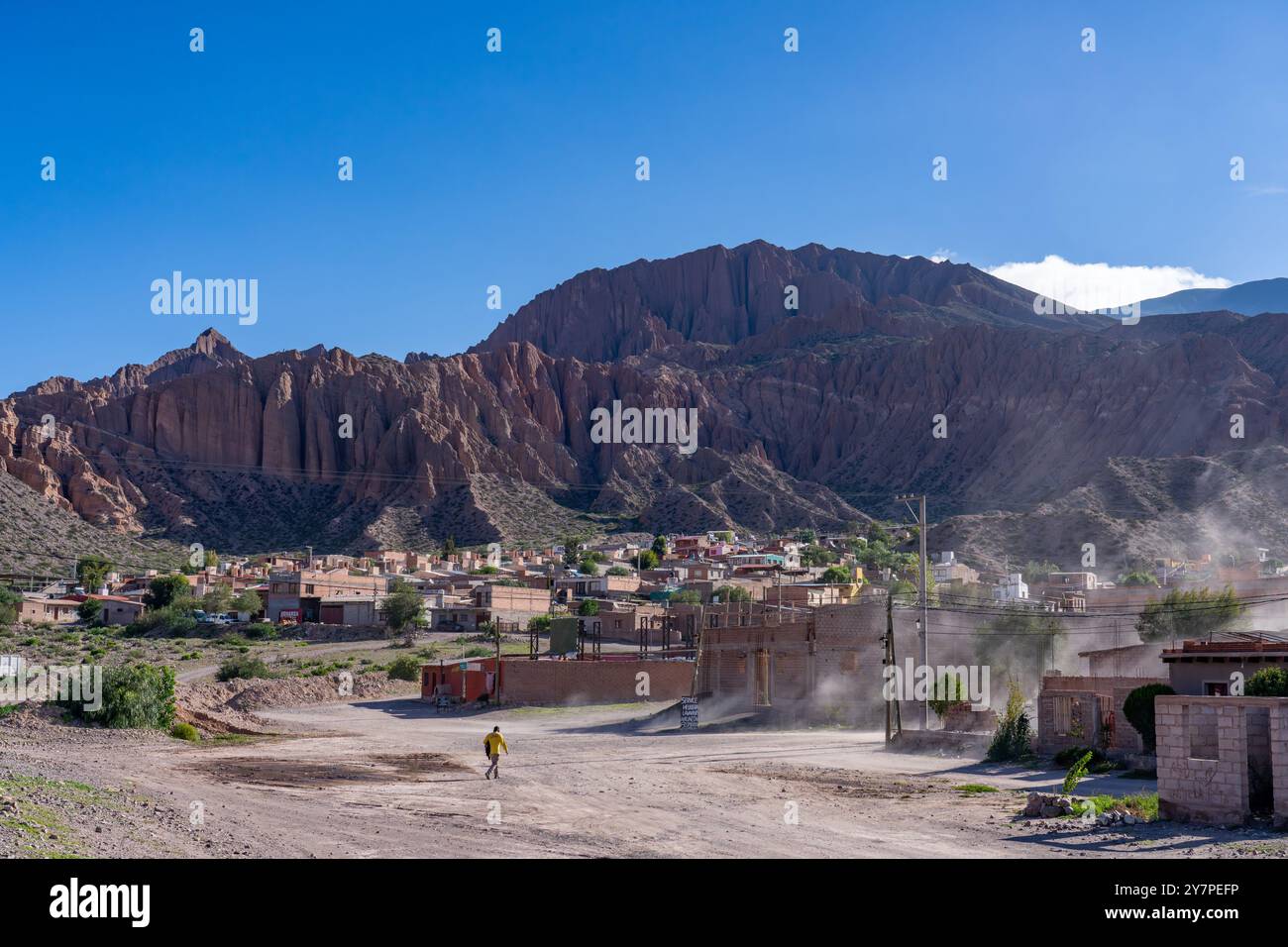 The town of Sumaj Pacha Alto below an eroded mountainside in the ...