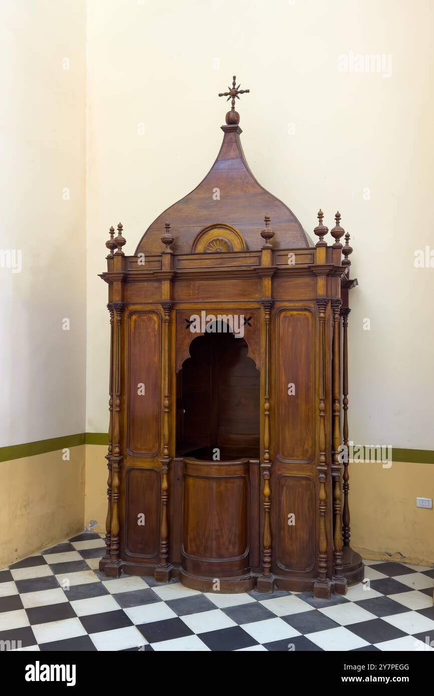 A carved wooden confessional booth in the Cathedral of Our Lady of the ...