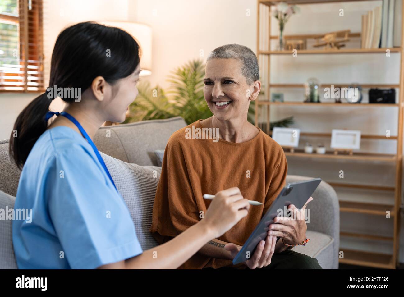 Healthcare Professional Visiting Senior at Home, Providing Medical ...