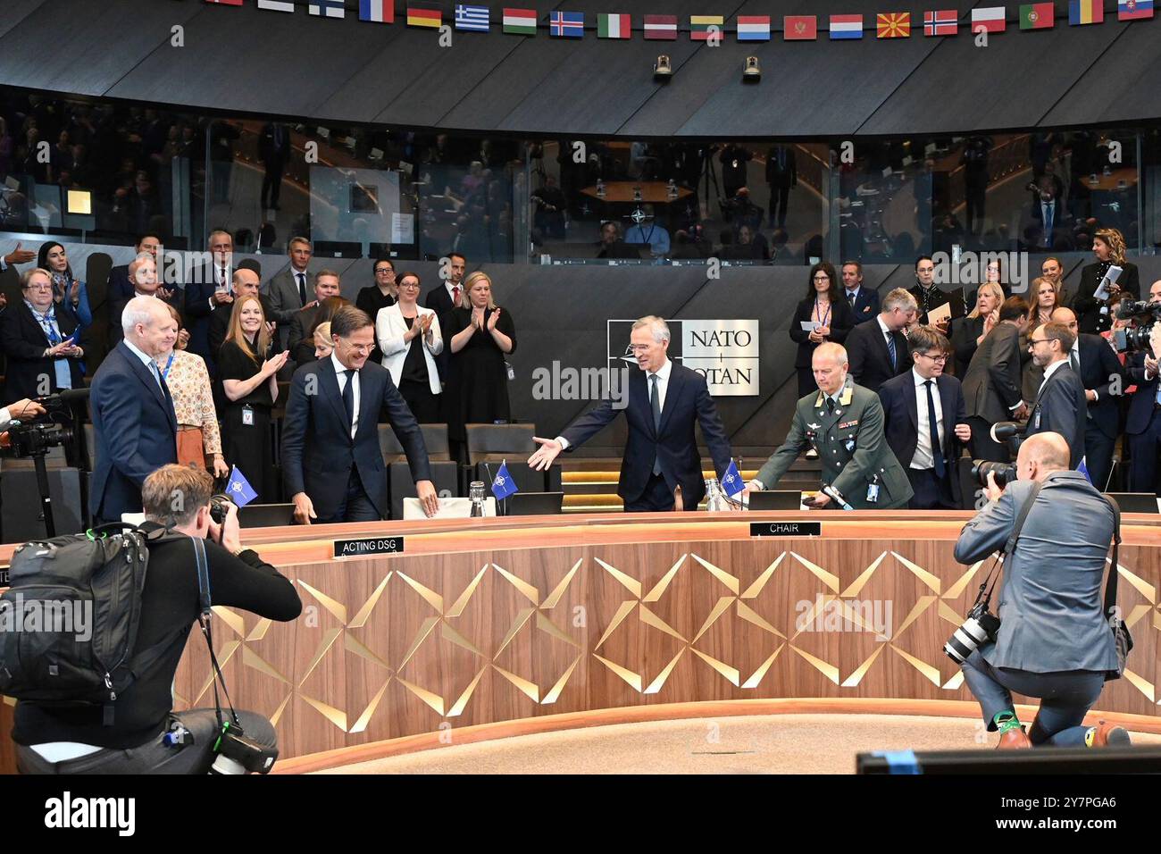 NATO Secretary General Jens Stoltenberg, center, welcomes the new NATO ...