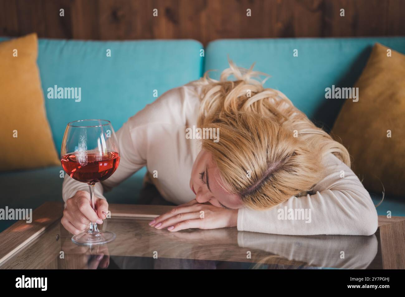 Photo of drunk tired lady wear white shirt drinking wine lying table ...