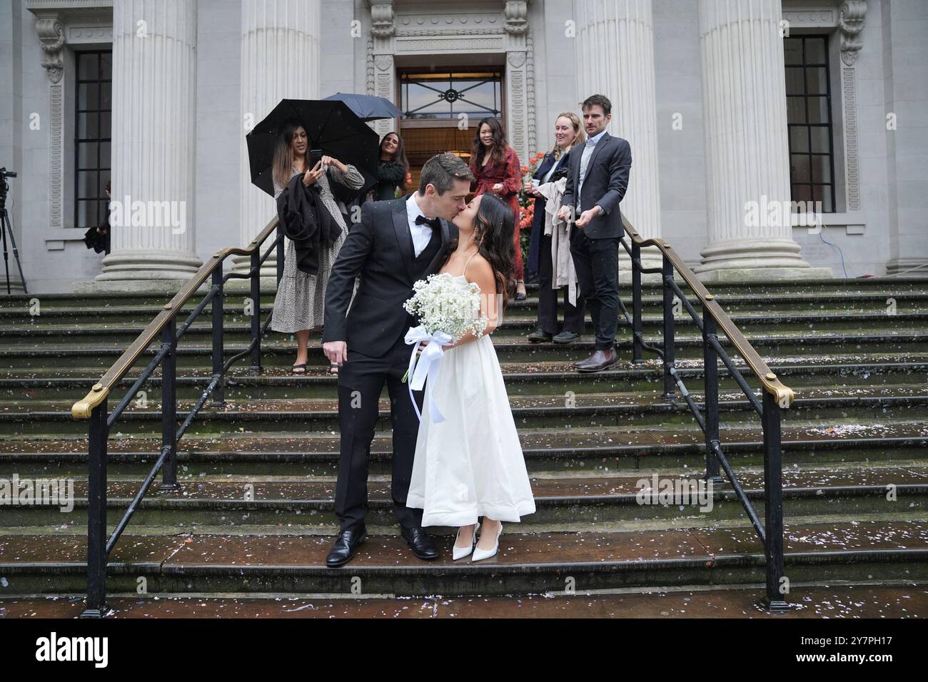 Australian couple Brad 31 and his bride Priscilla 32, Standfield kiss ...