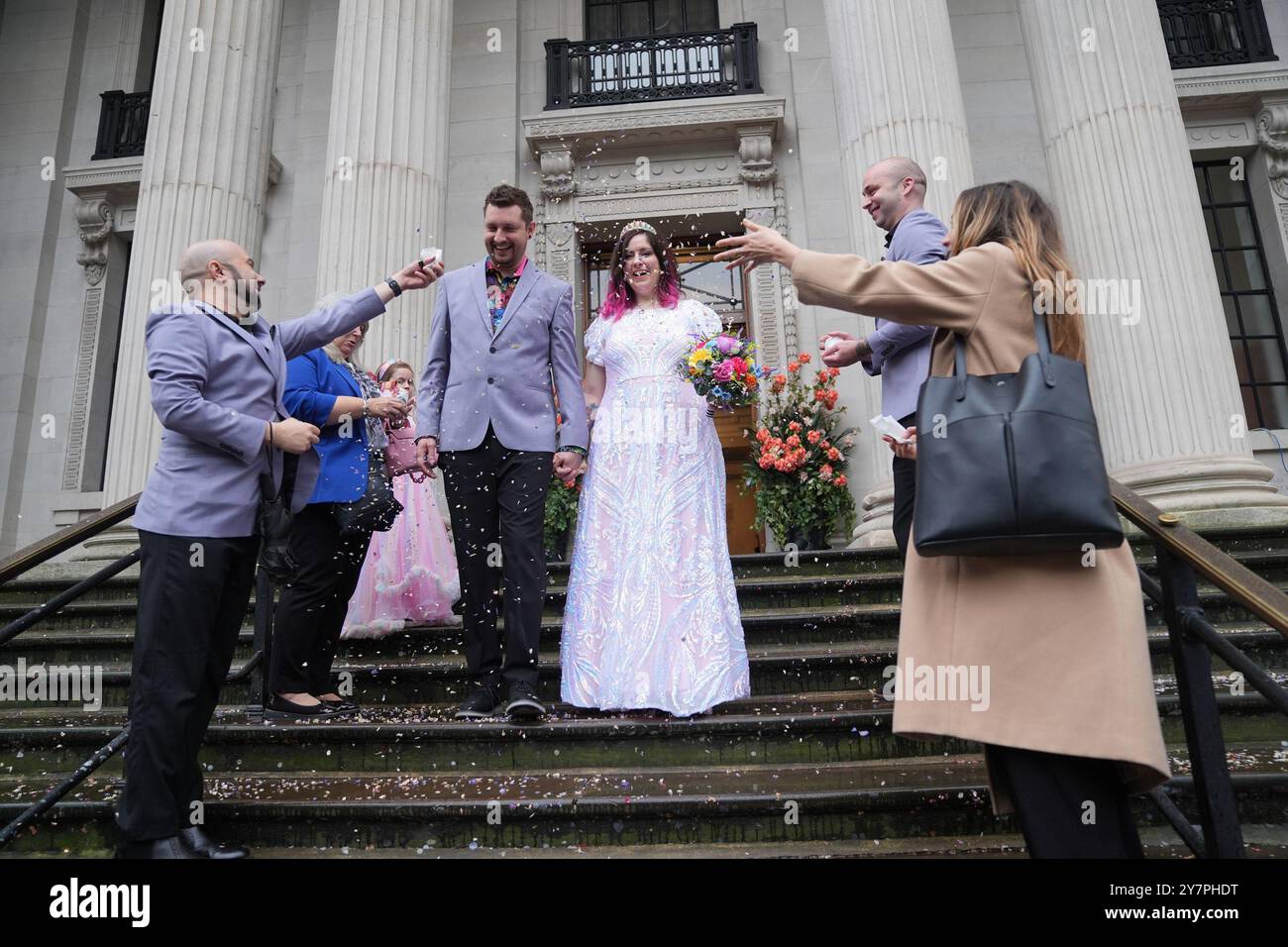 Newly married couple, Kris, 40 and Sally, 37, Wall, walk down the steps ...