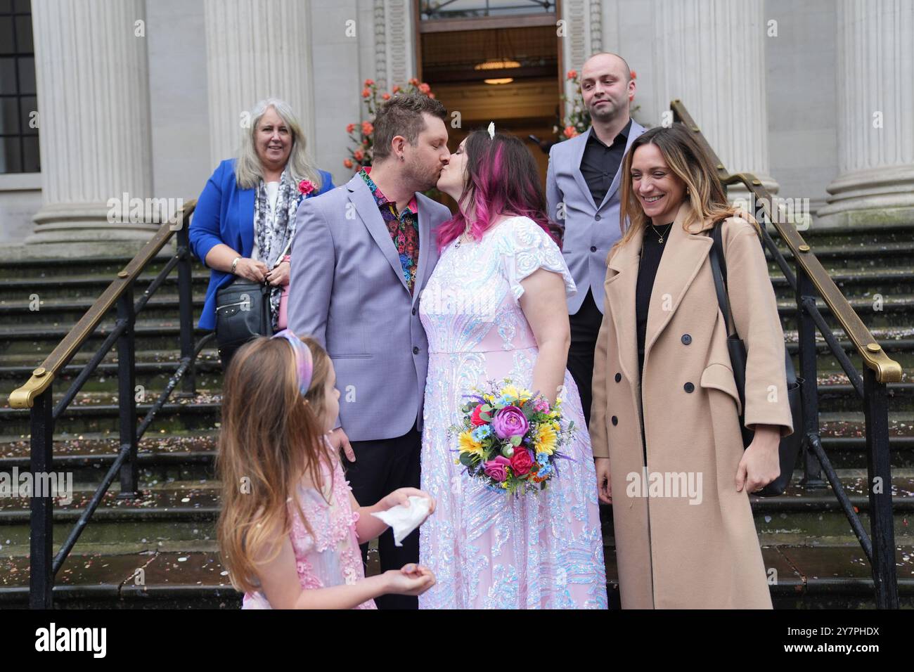 Newly married couple, Kris, 40 and Sally, 37, Wall, kiss on the steps ...