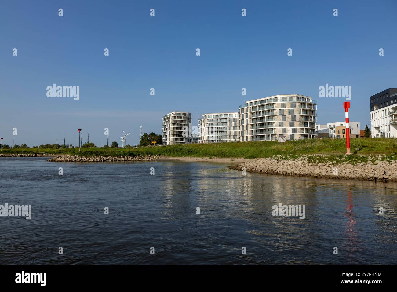 Facades of newly build luxury apartment buildings along riverside of ...