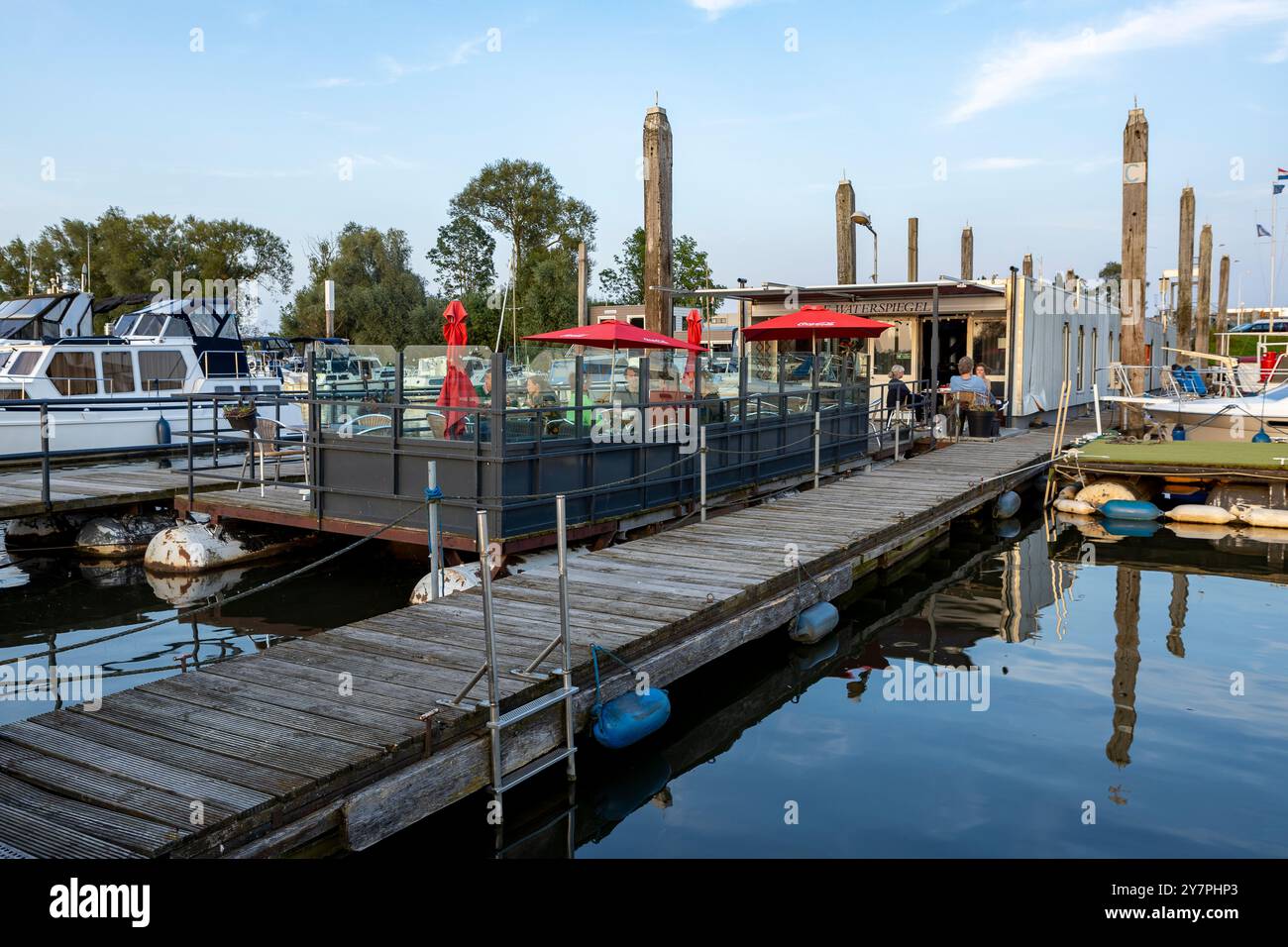 Floating restaurant with fishing boats and sailing logger in museum ...