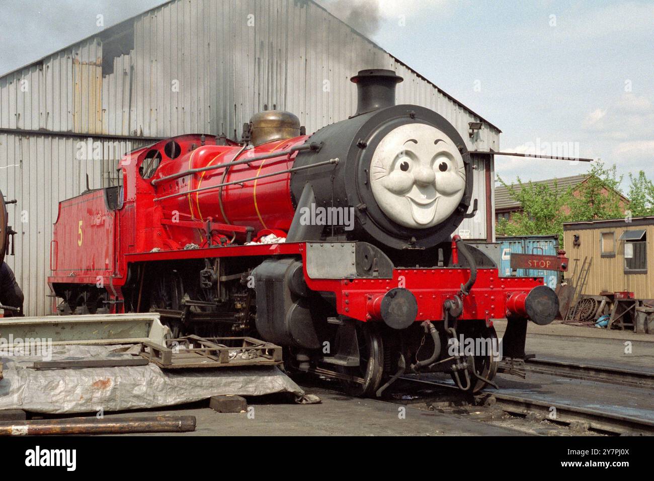 A red steam locomotive 5 with a smiling face at the Great Central ...
