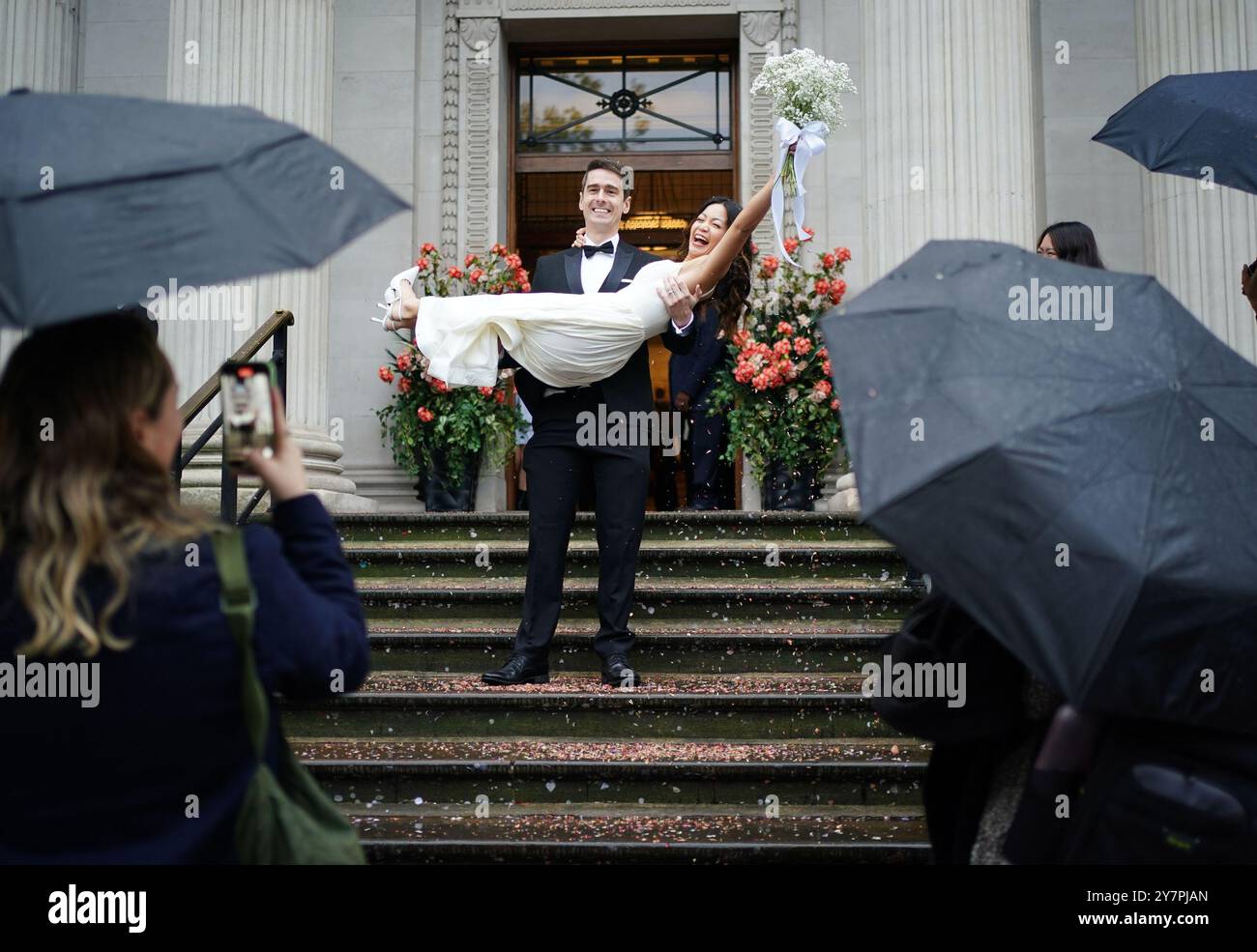 Newly married Australian couple Brad, Standfield, 31 lifts his new wife ...