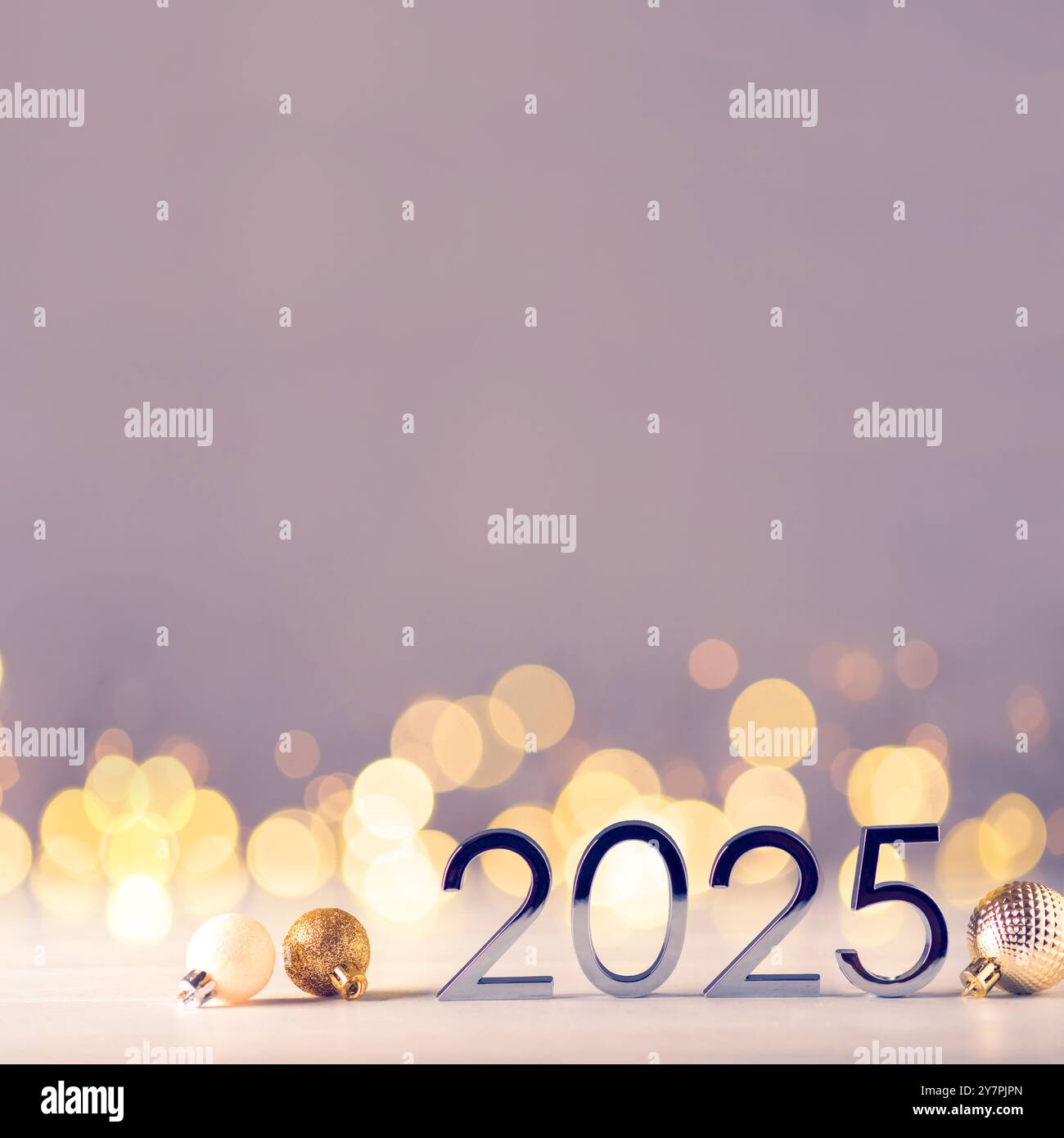 Metal numbers 2025 on table with bokeh lights Stock Photo - Alamy