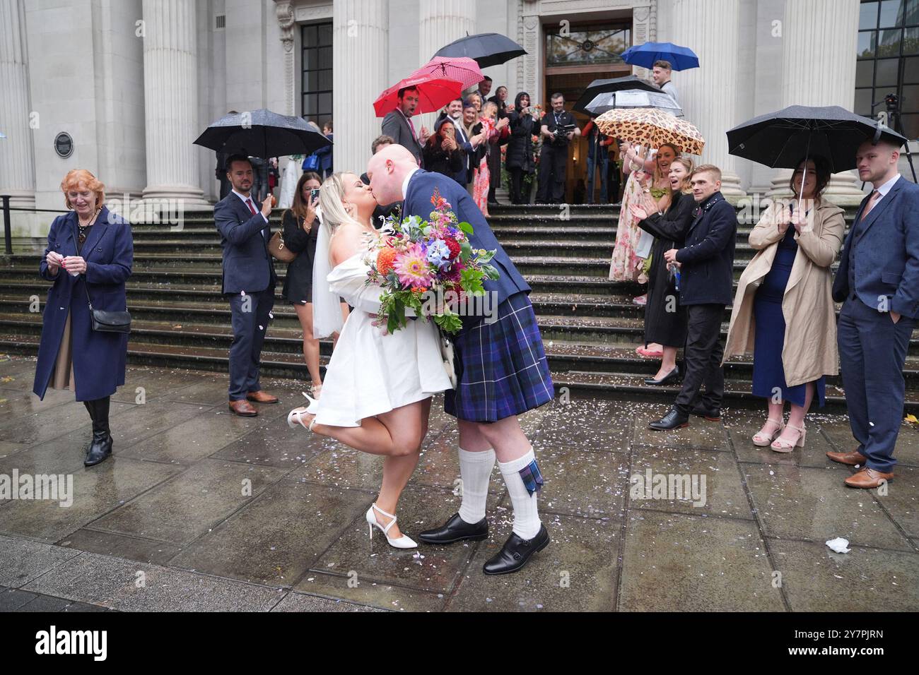 Newly married couple Thomas and Paige Mackintosh from Aberdeen, kiss ...