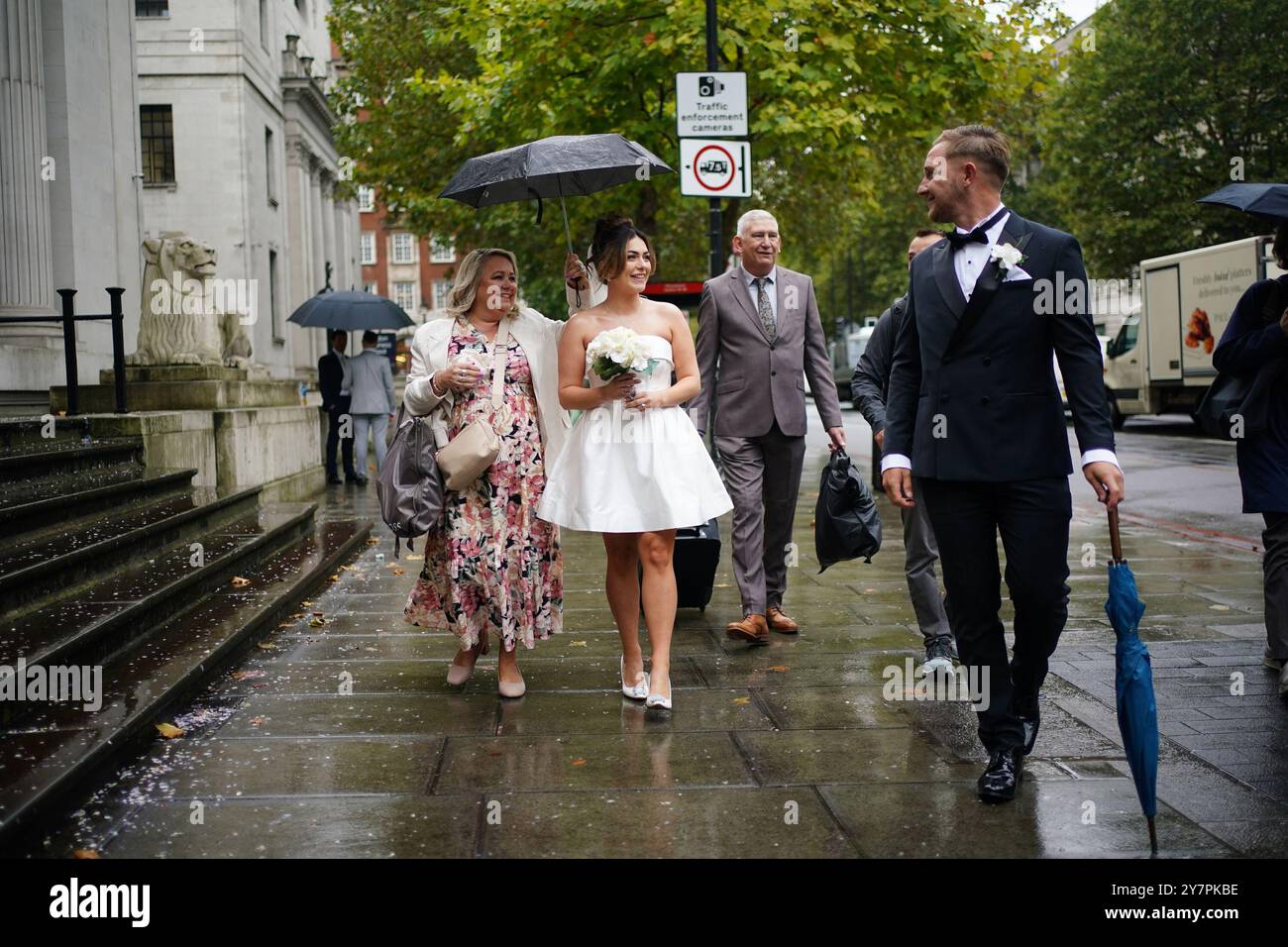 Jack and Katie Webster arrive at Old Marylebone Town Hall in London ...