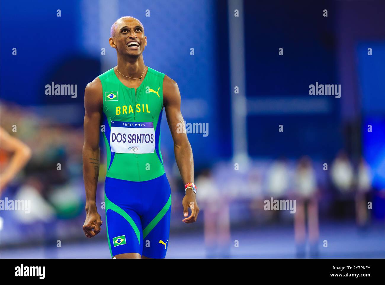 Alison dos Santos celebrating with her country's flag in the 400 meters ...