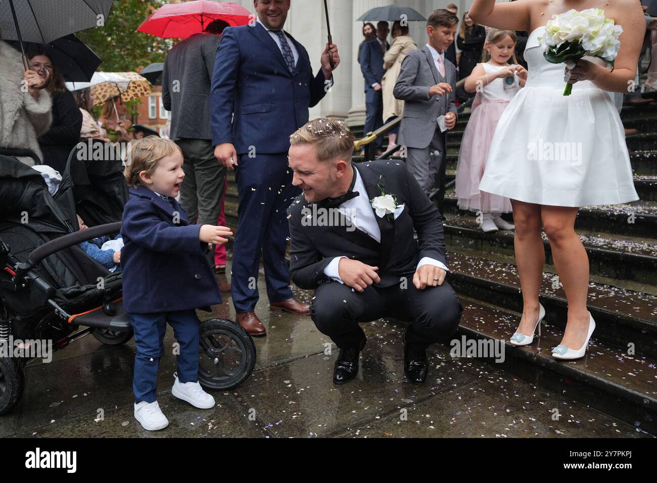 Jack Webster is showered with confetti by Austen Trafford, 2, at Old ...